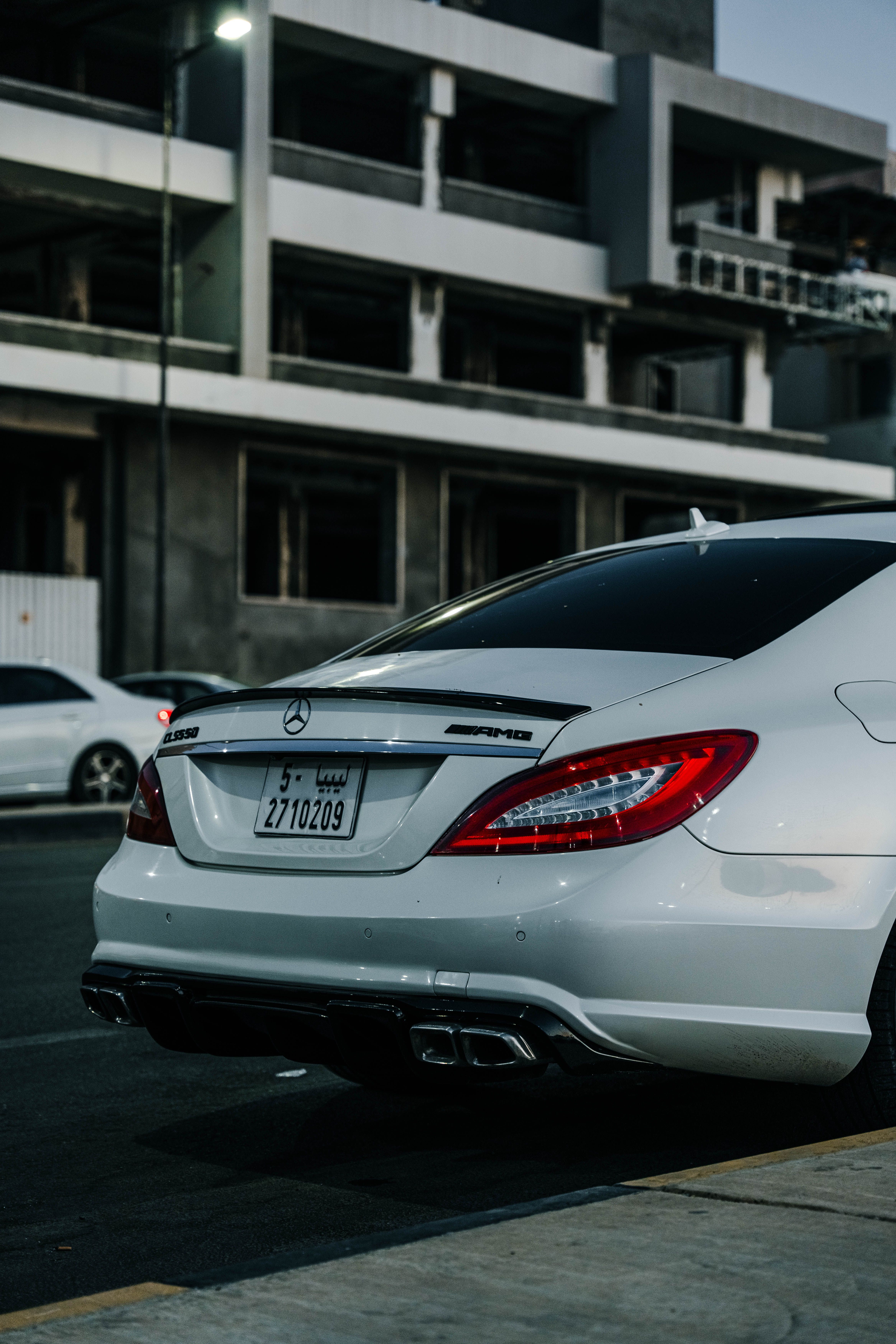 Elegant White Mercedes Benz in Urban Setting · Free Stock Photo