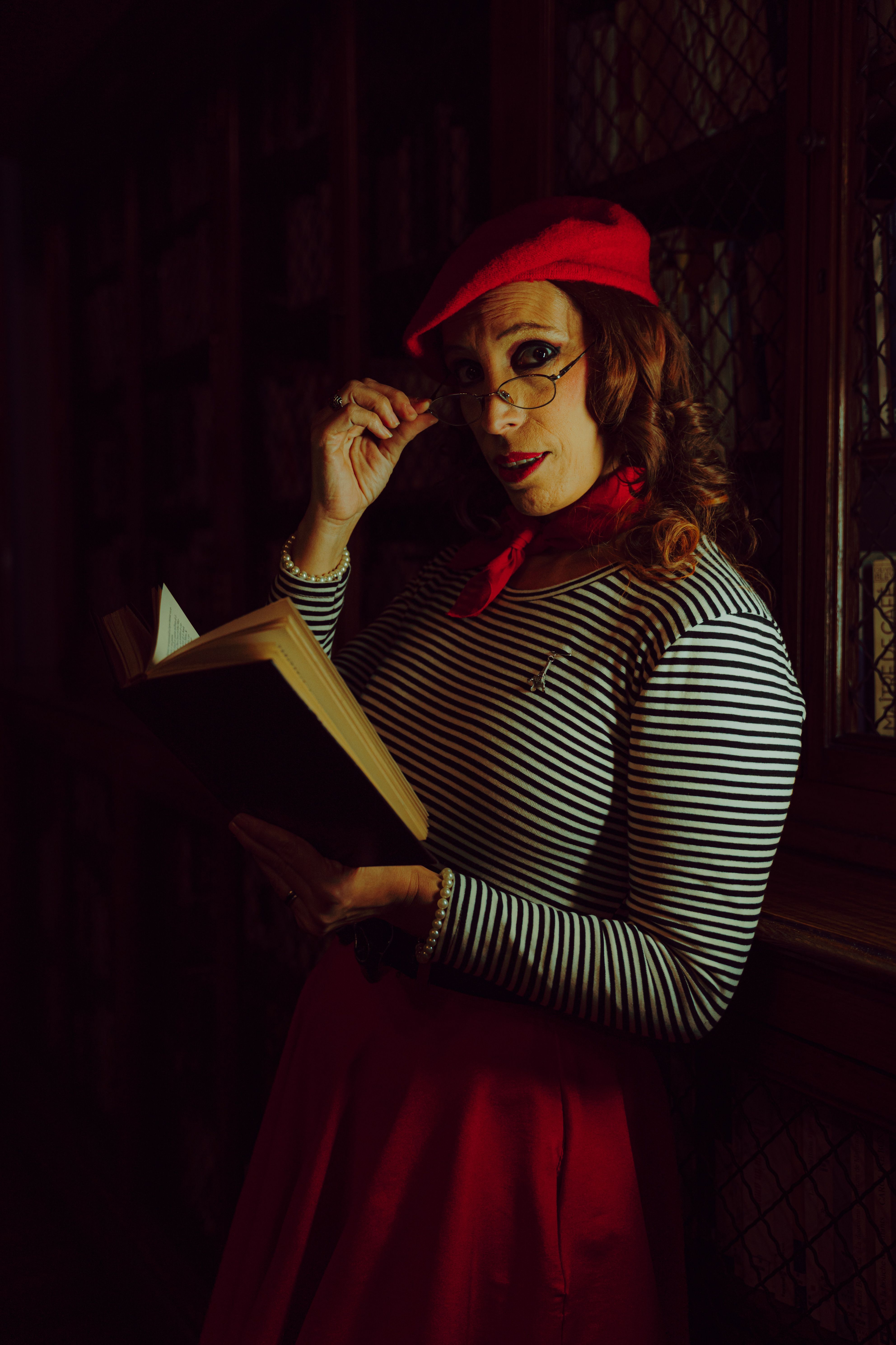 Stylish Woman Reading in Vintage French Attire · Free Stock Photo