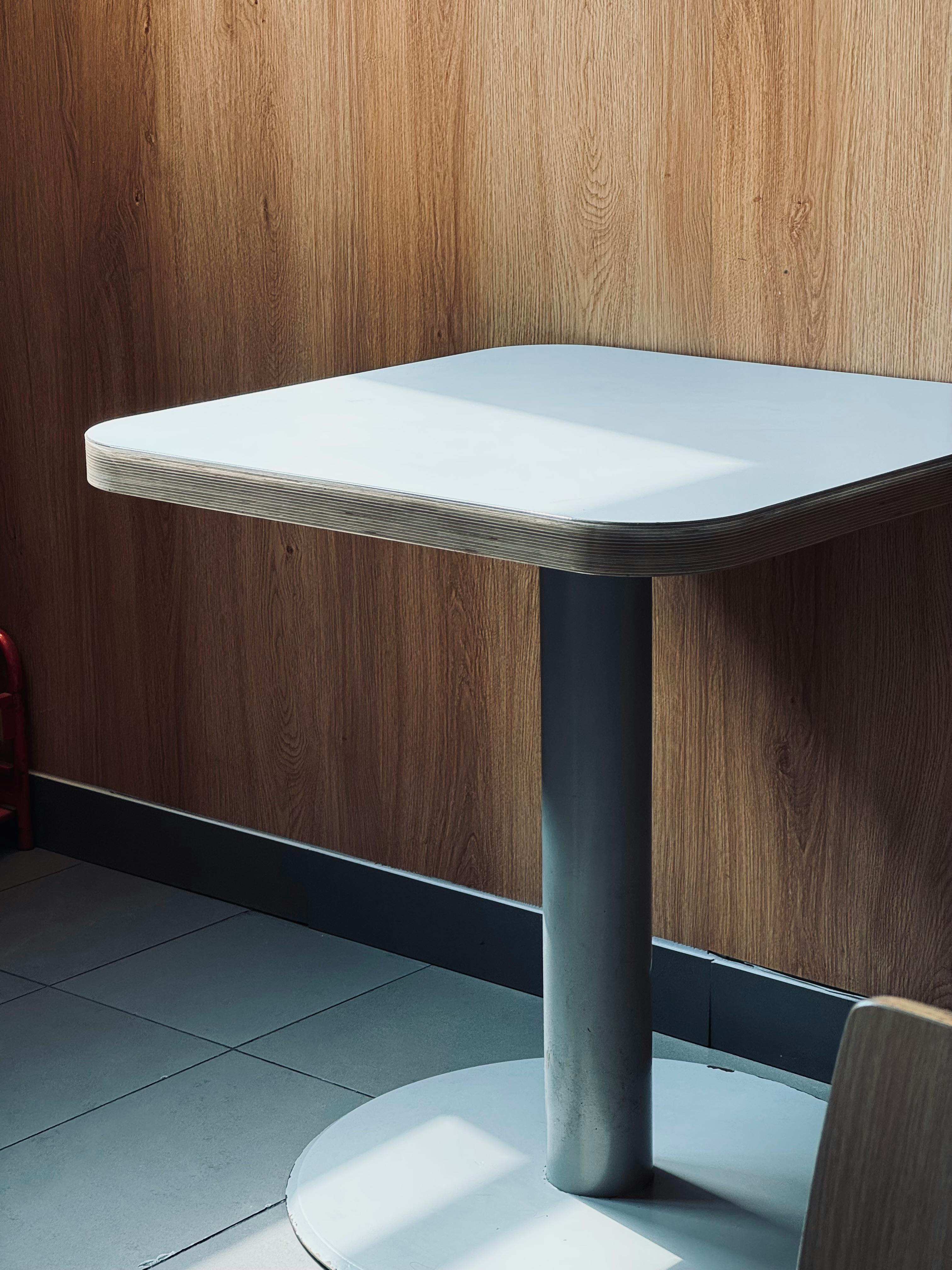 Modern Minimalist Table in Sunlit Interior · Free Stock Photo