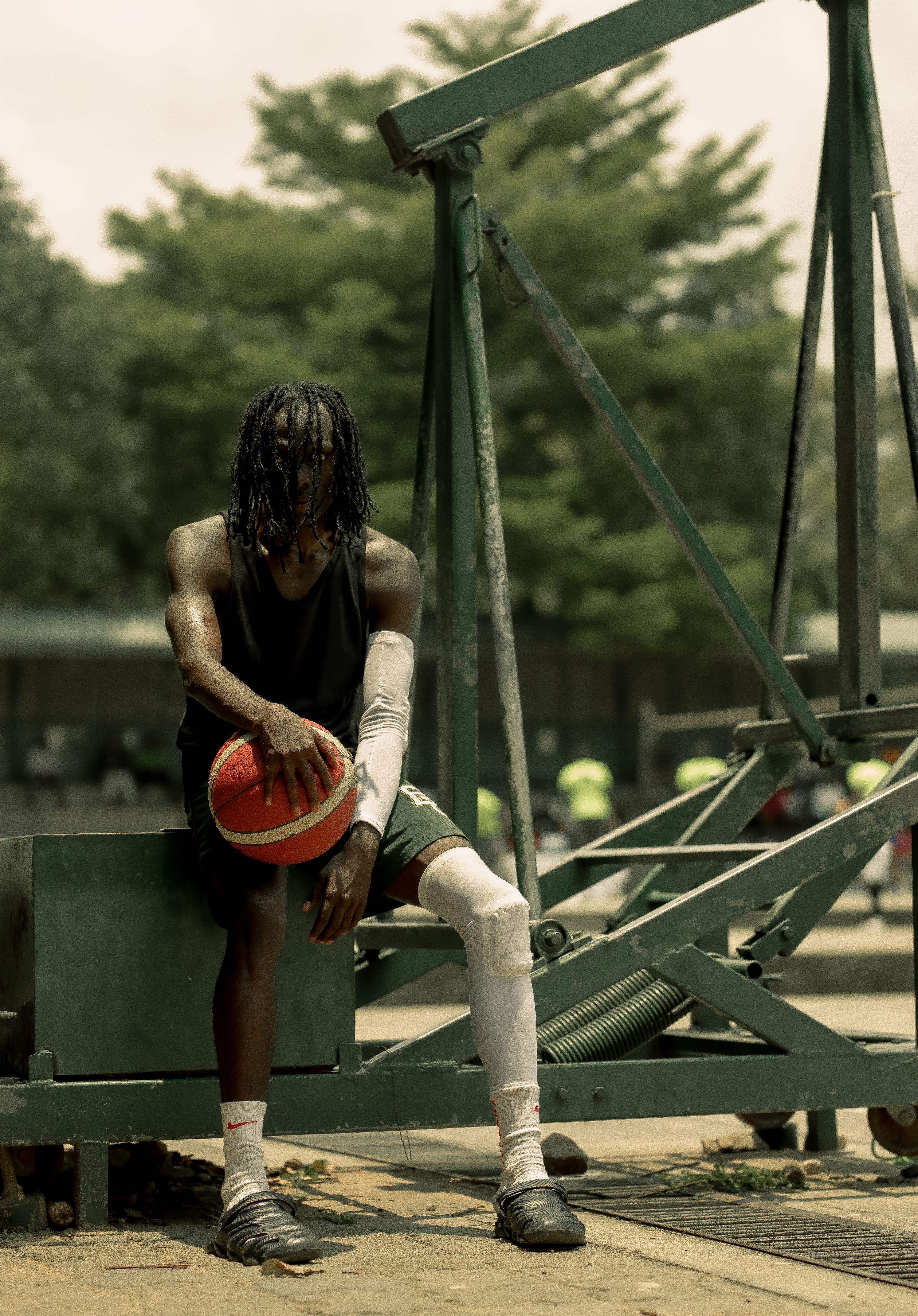 Young Basketball Player Resting Outdoors · Free Stock Photo
