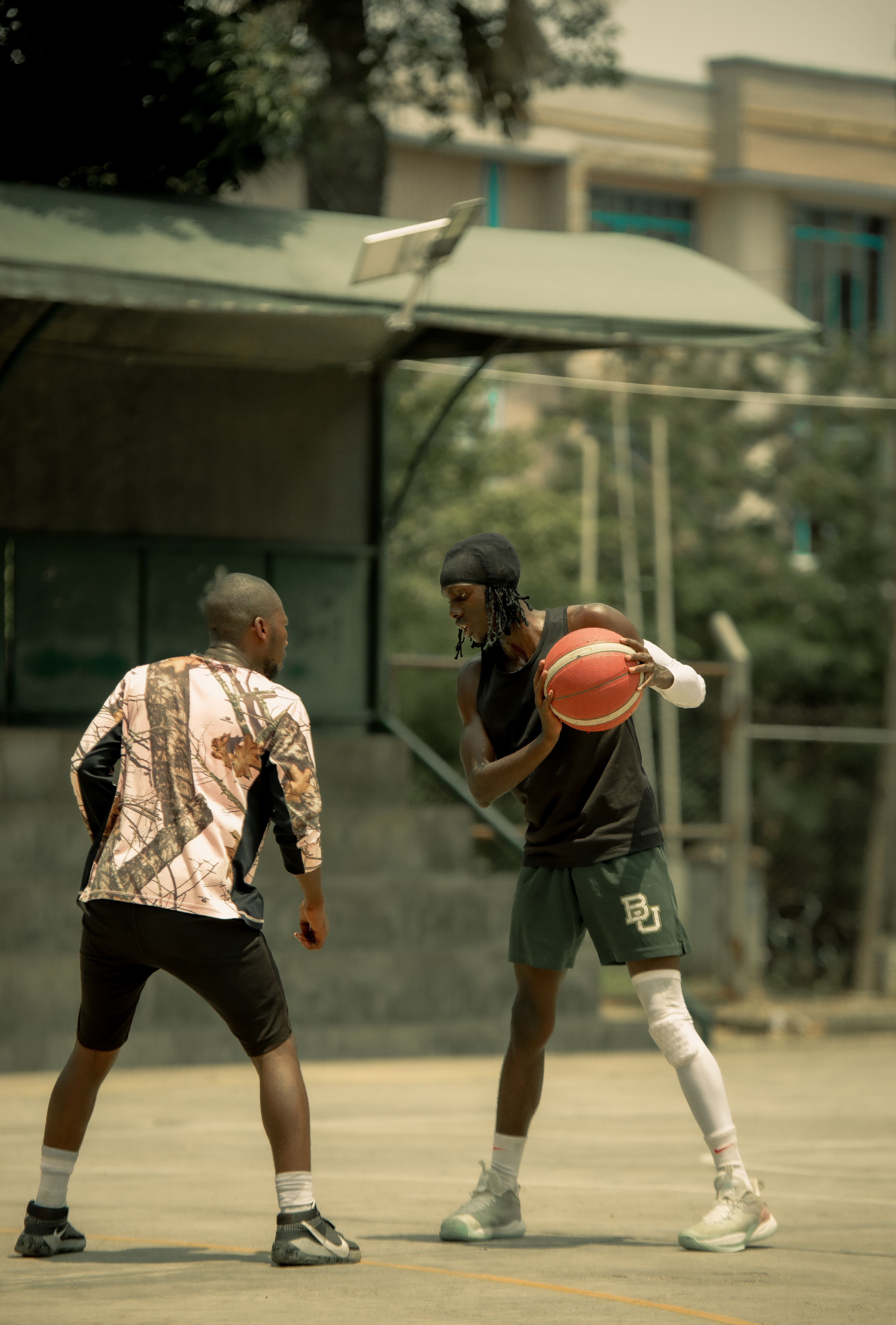 Two Men Playing Basketball Outdoors in Summer · Free Stock Photo