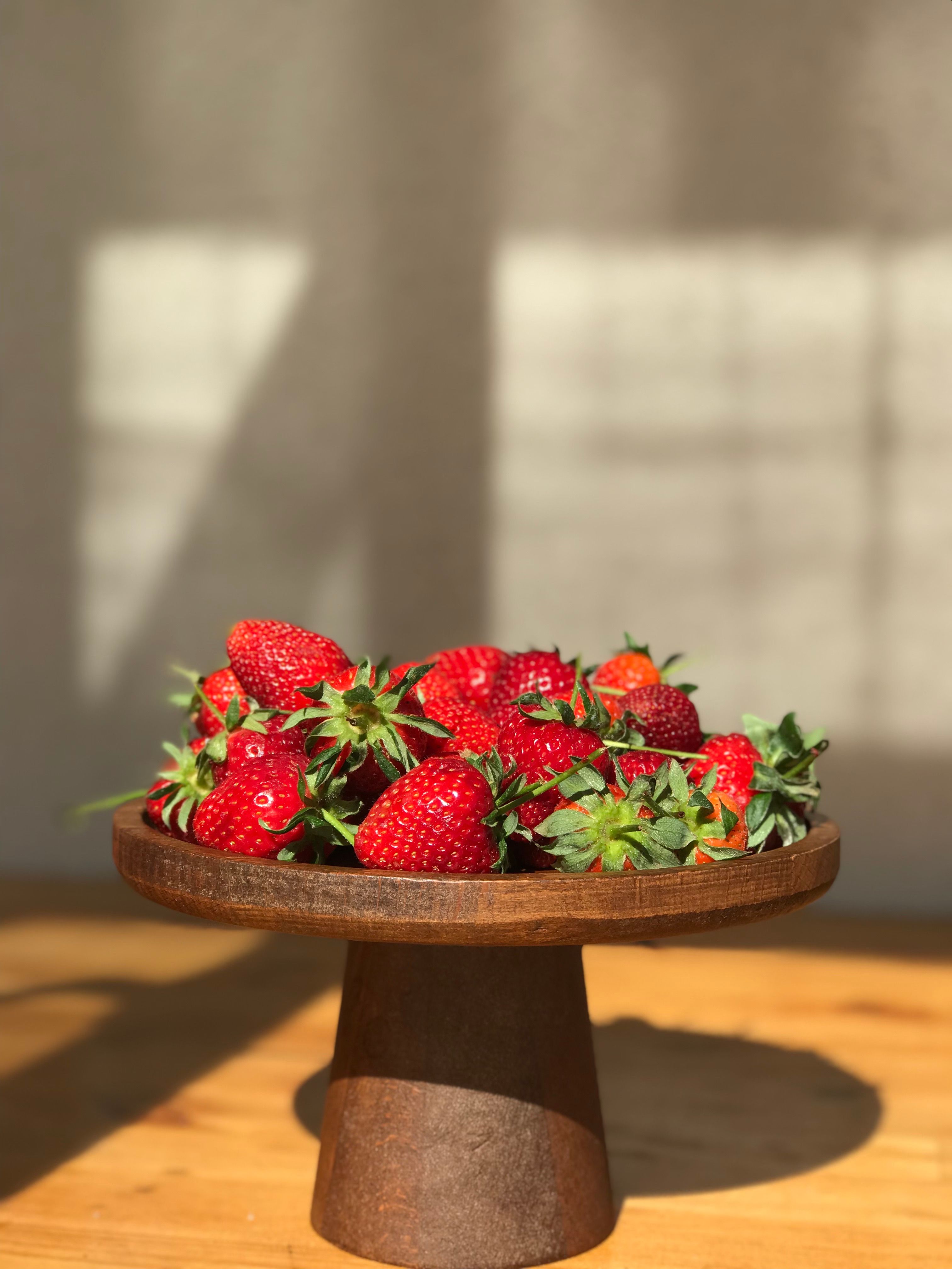 Fresh Strawberries on Elegant Wooden Stand · Free Stock Photo