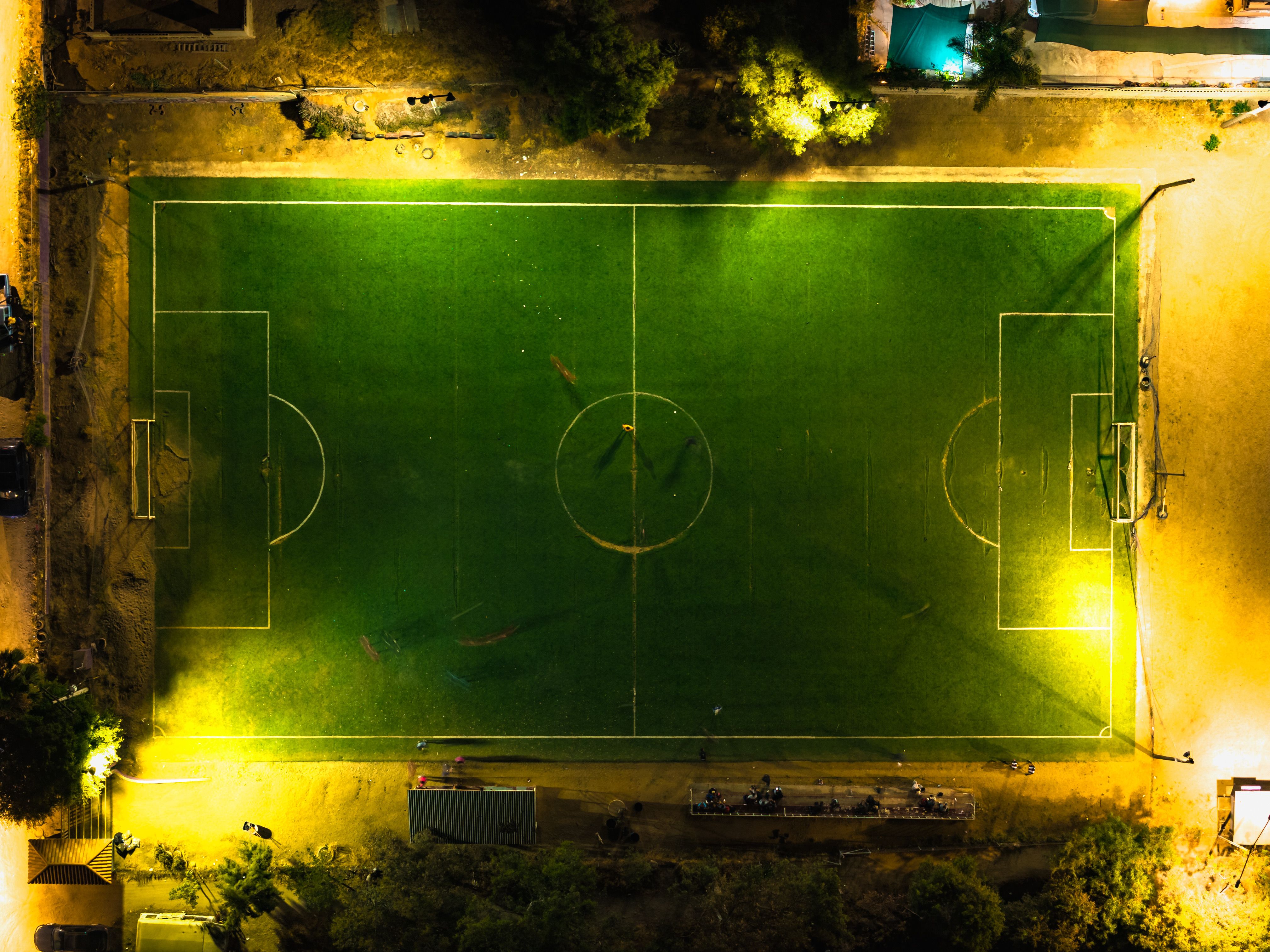 Aerial View of Evening Soccer Match in Urban Setting · Free Stock Photo