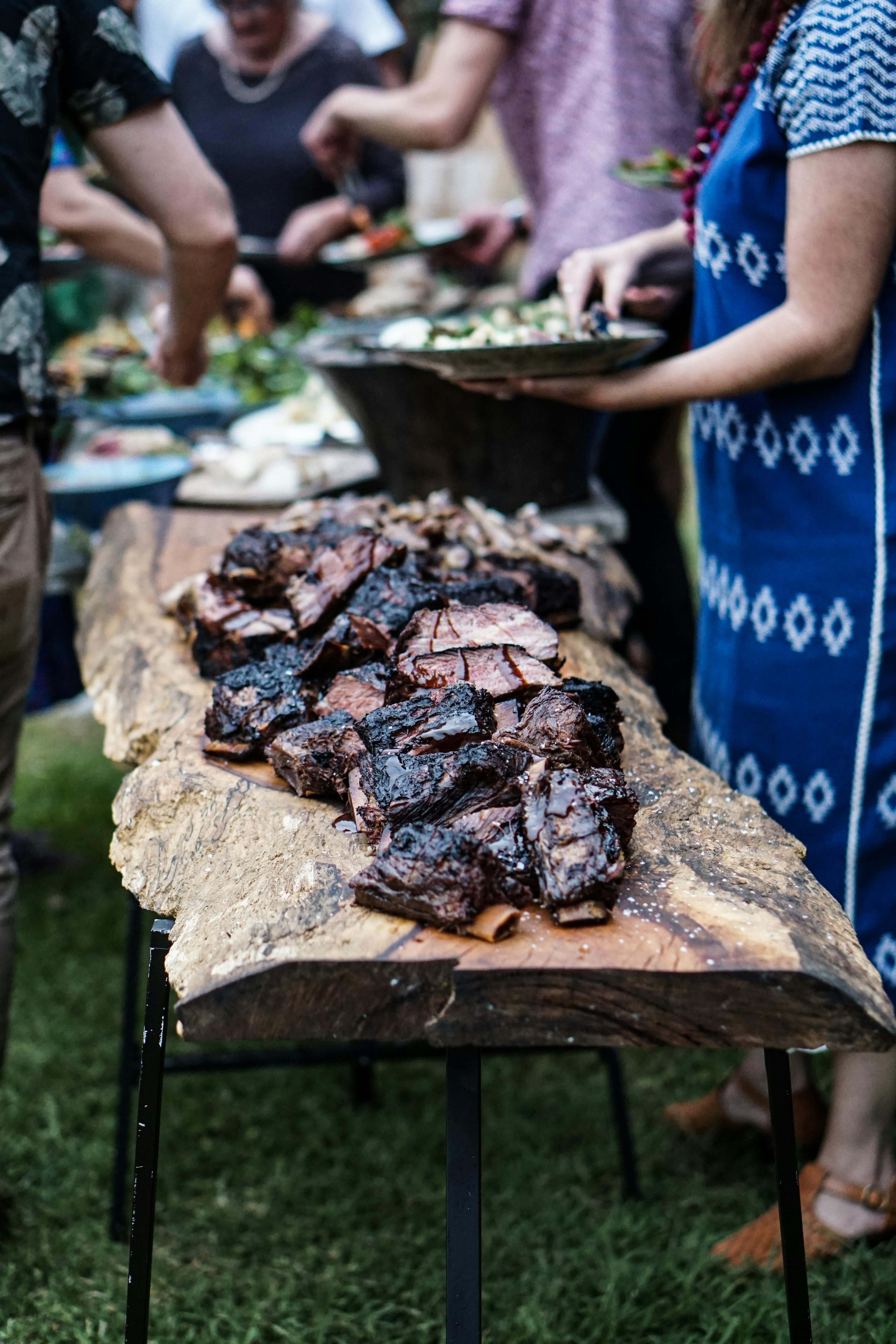 Grilled Meat Laid on a Wood Slab · Free Stock Photo