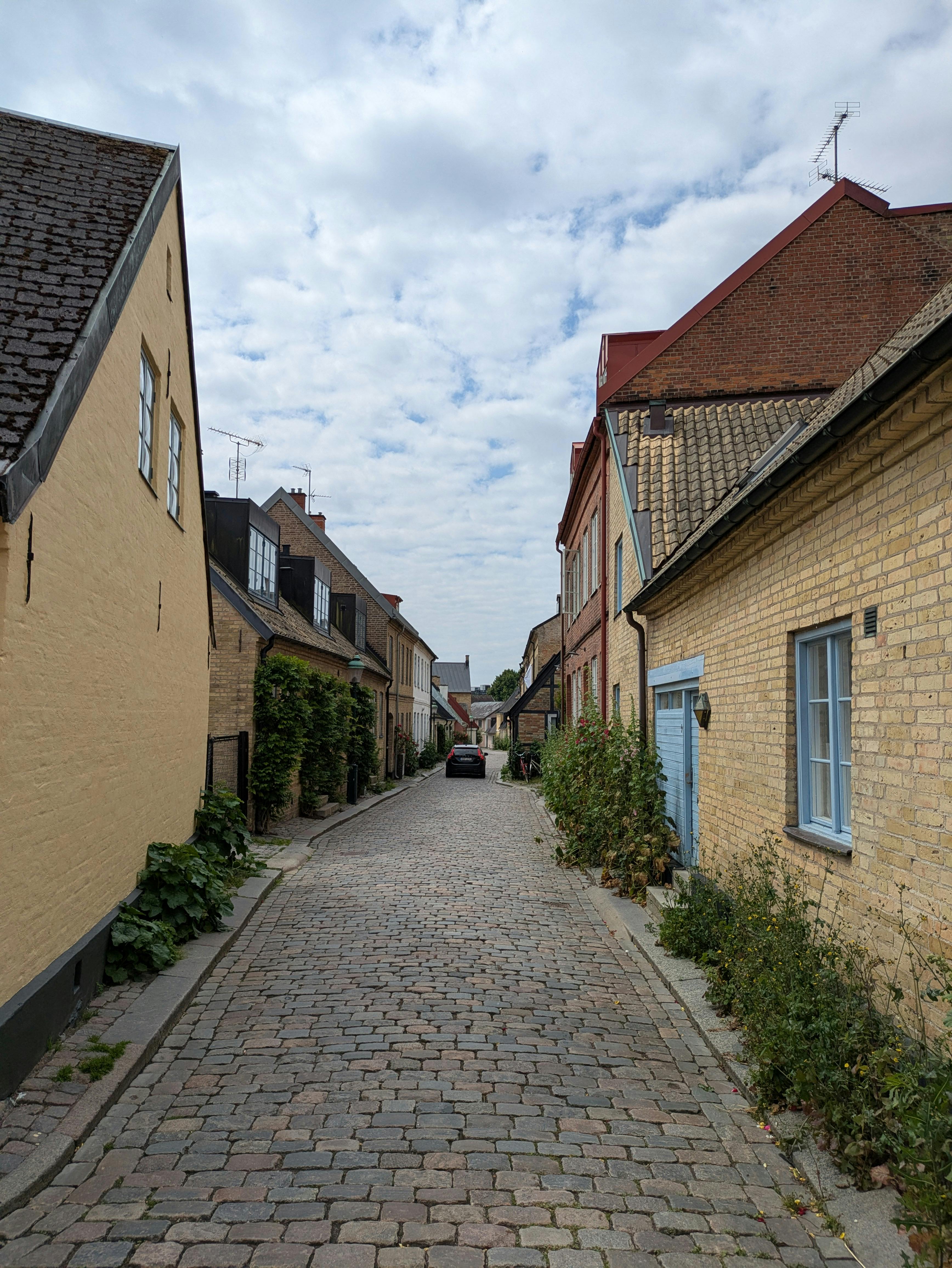 Charming Cobblestone Street in Quaint European Town · Free Stock Photo