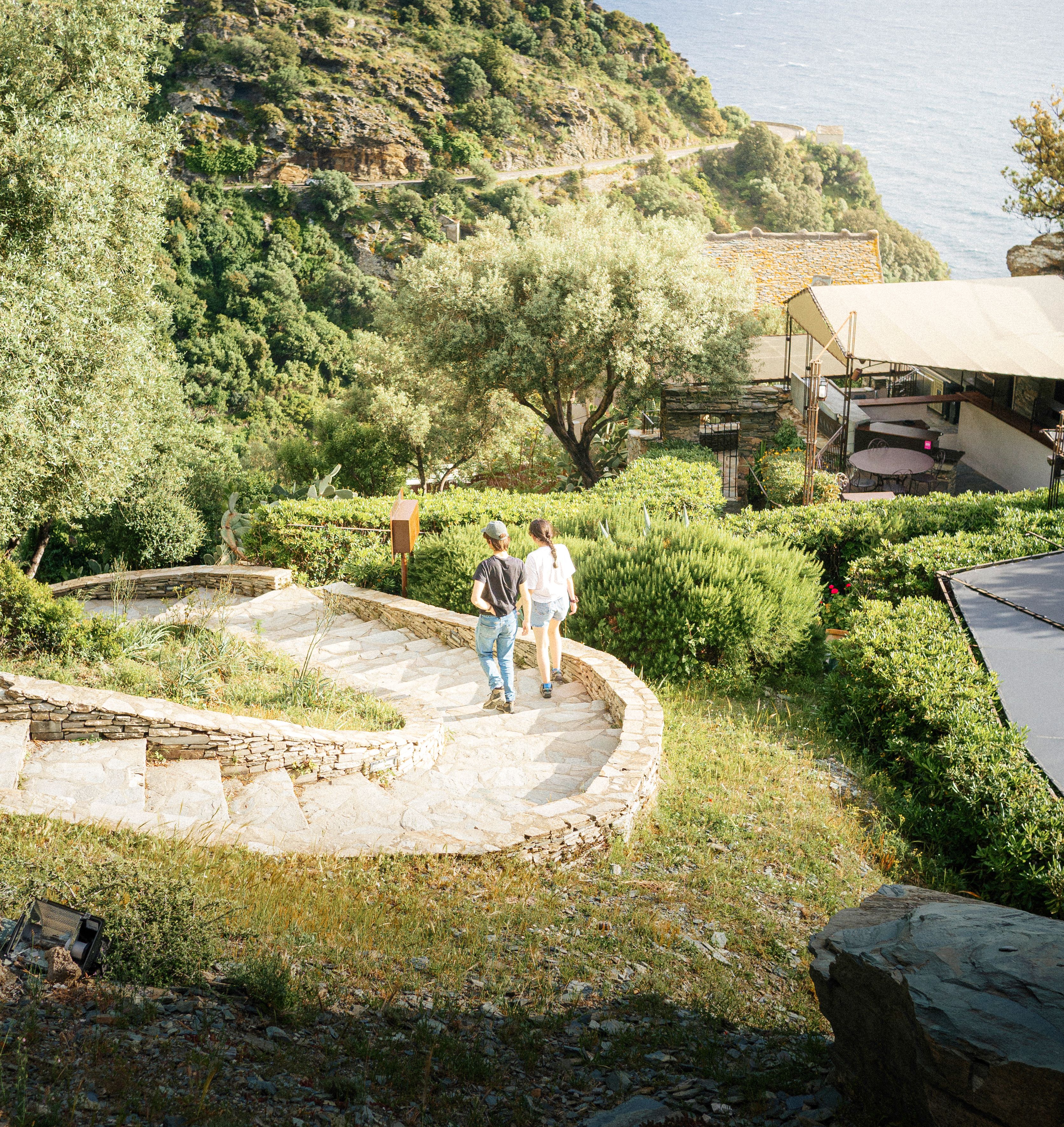 Couple Walking on Scenic Path in Corsica · Free Stock Photo
