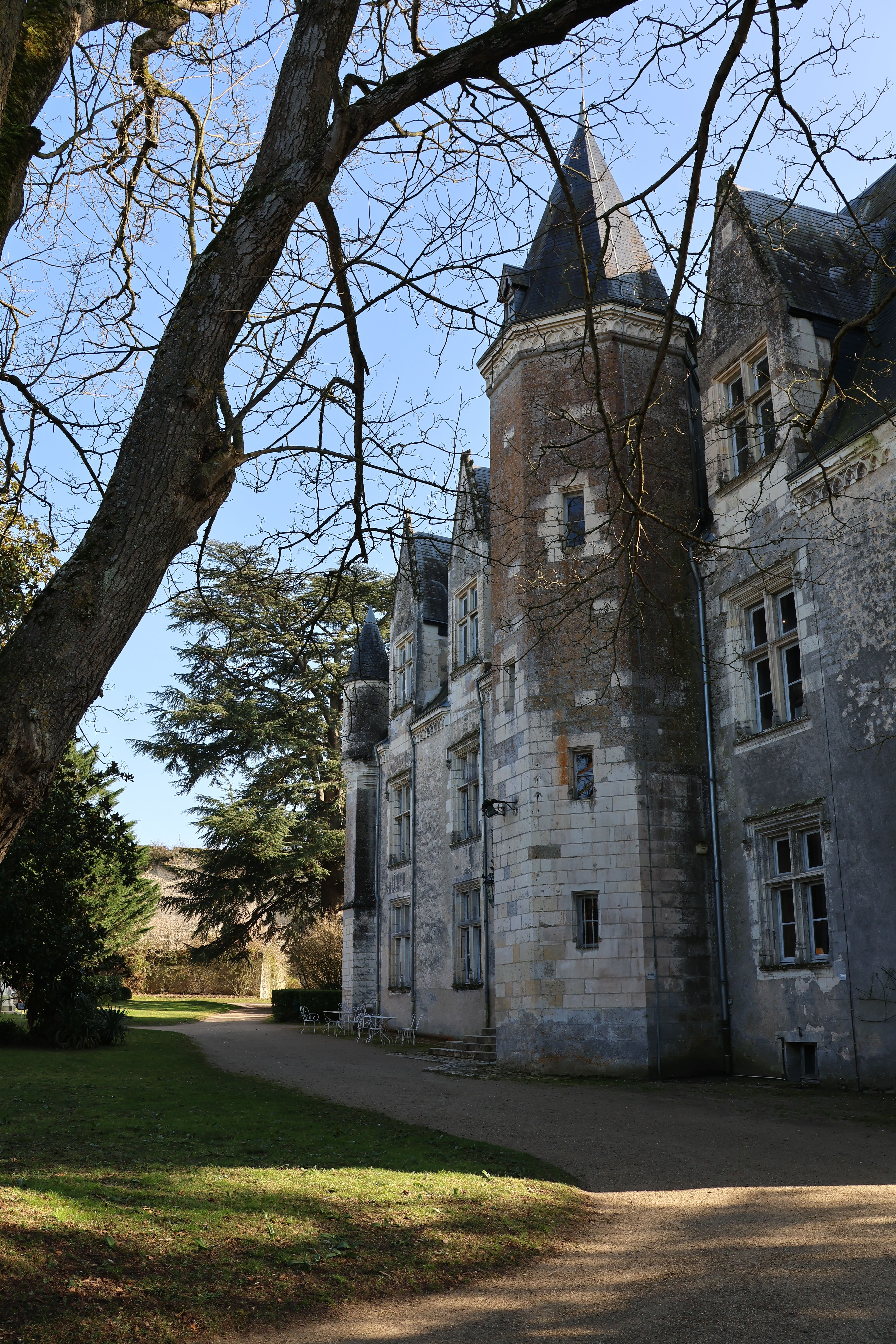 Historic Stone Castle with Turrets in Spring · Free Stock Photo