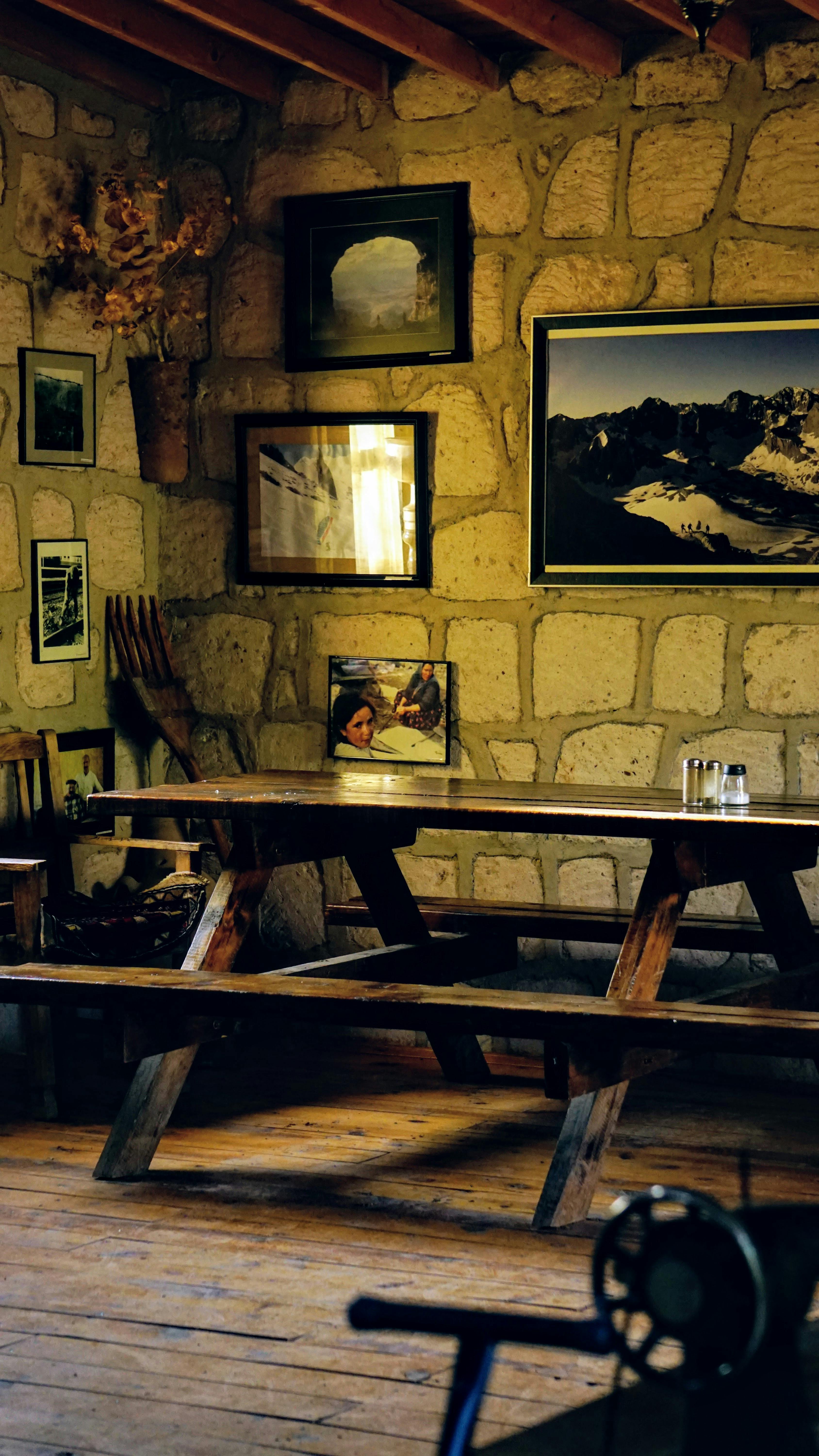 Cozy Rustic Cafe Interior with Stone Walls · Free Stock Photo