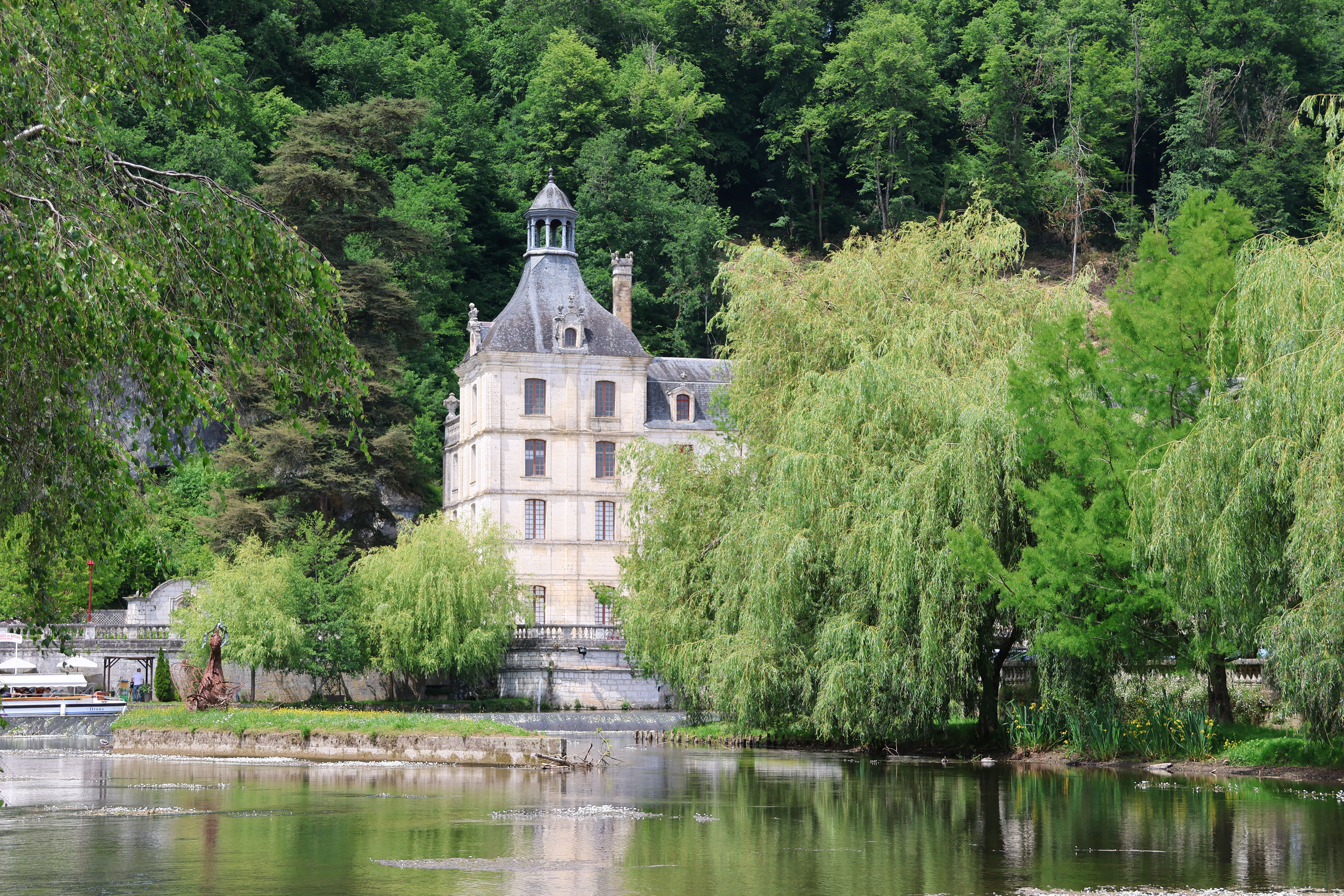 Charming Chateau by Riverside in Lush Green Forest · Free Stock Photo