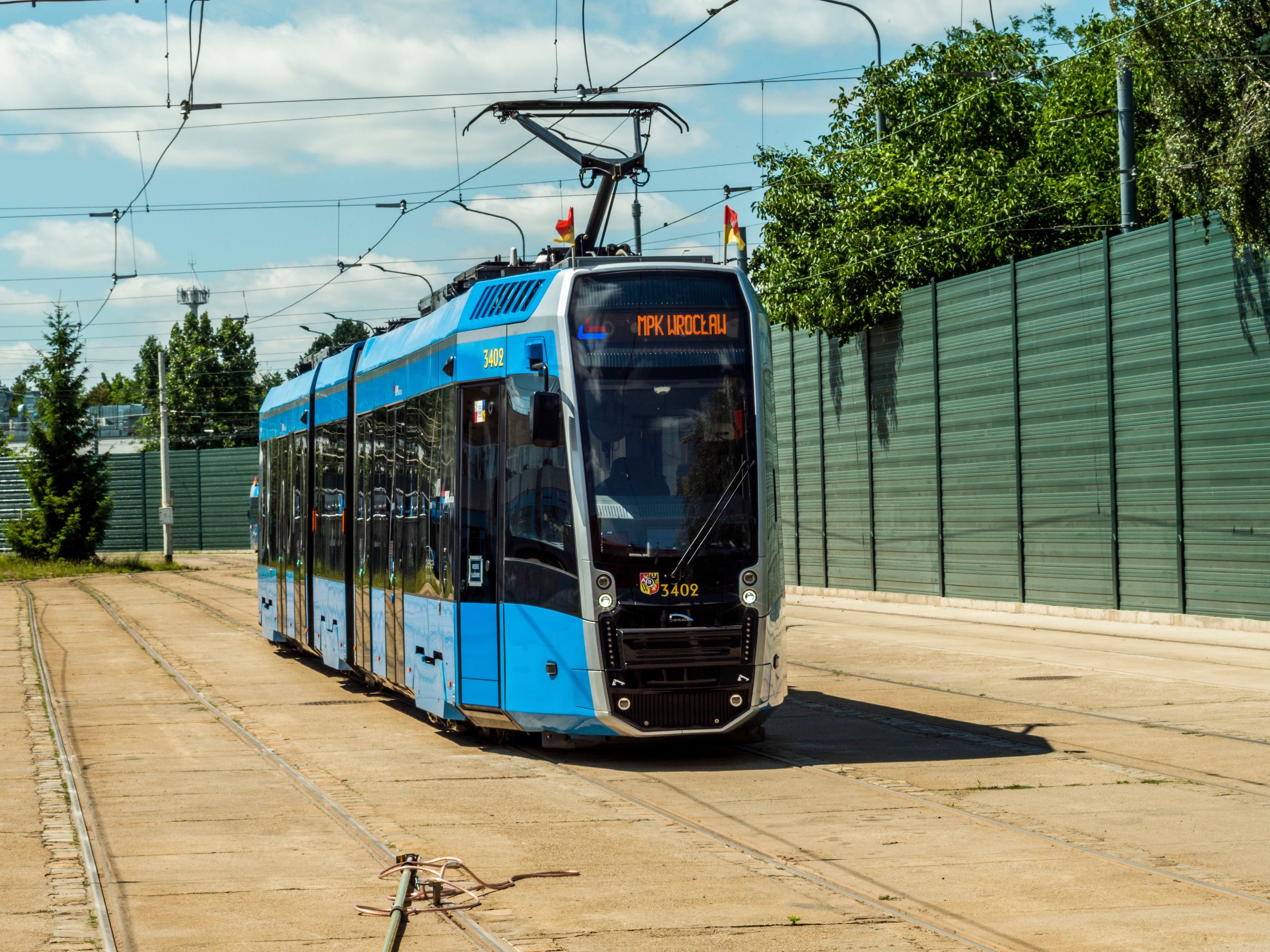 Modern Blue Tram in Sunny Wroclaw Station · Free Stock Photo