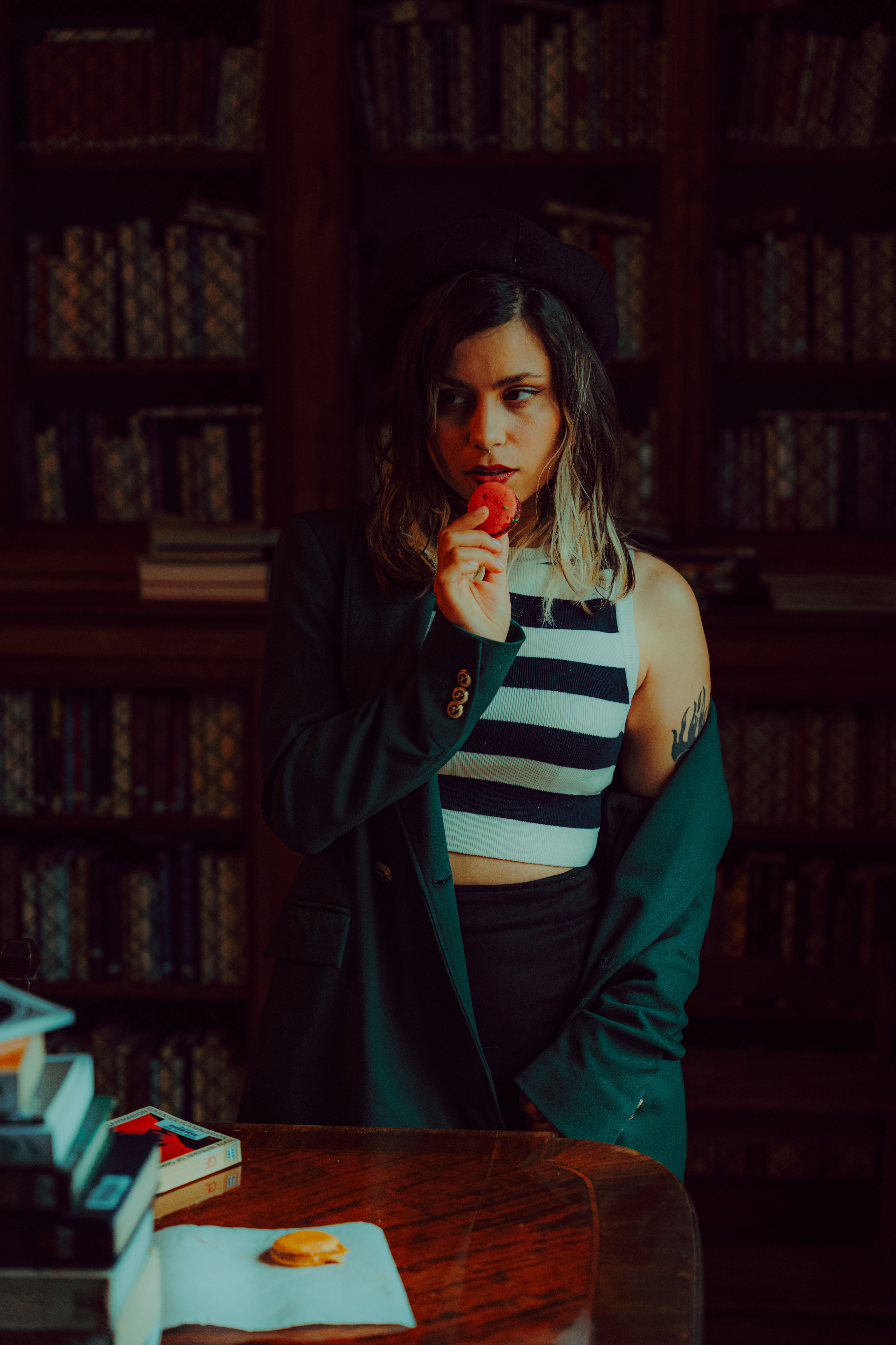 Contemplative Woman in Library Setting · Free Stock Photo