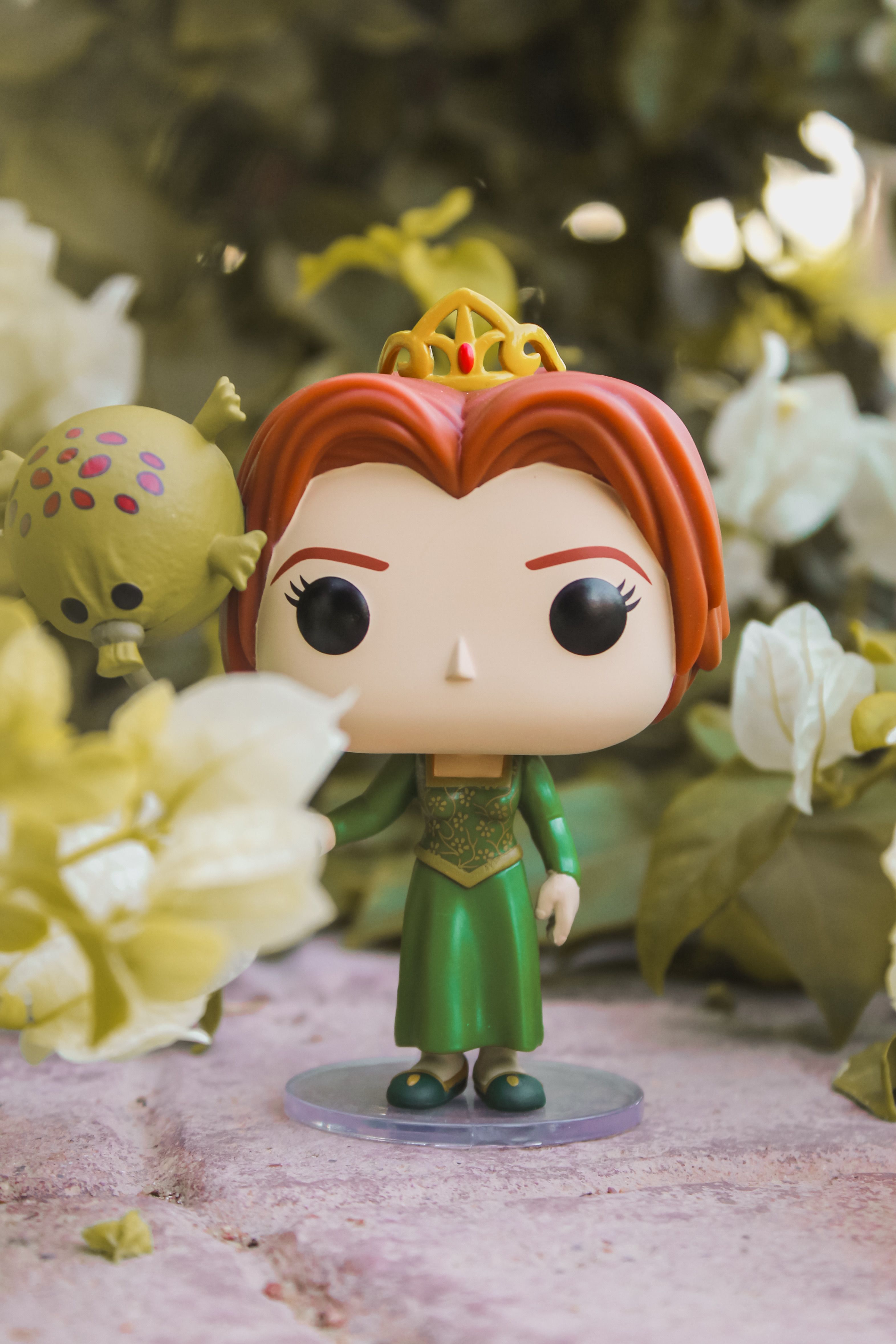 Charming Pop Vinyl Figure in Fantasy Setting · Free Stock Photo
