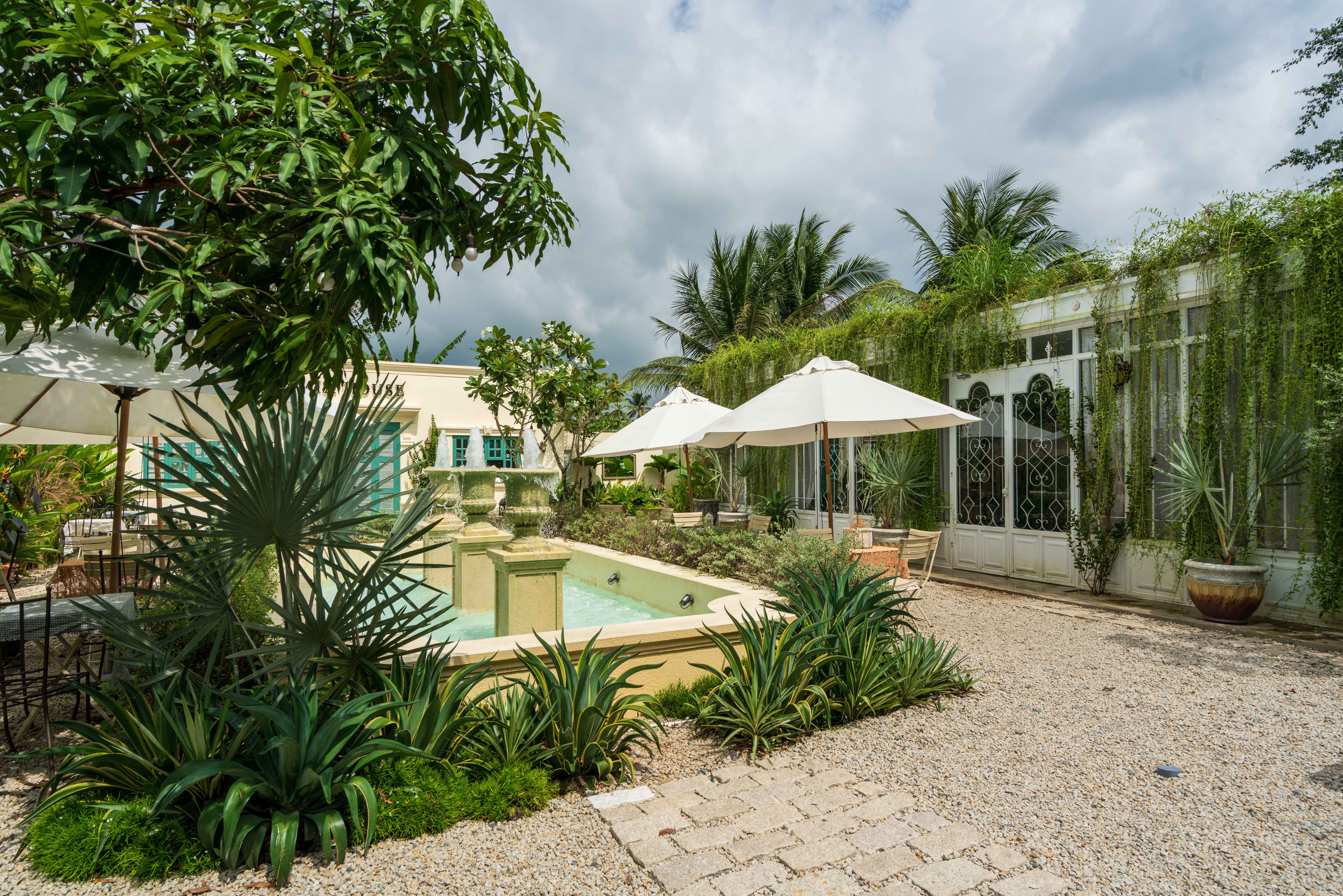 Elegant Courtyard with Lush Greenery and Charming Fountain · Free Stock ...