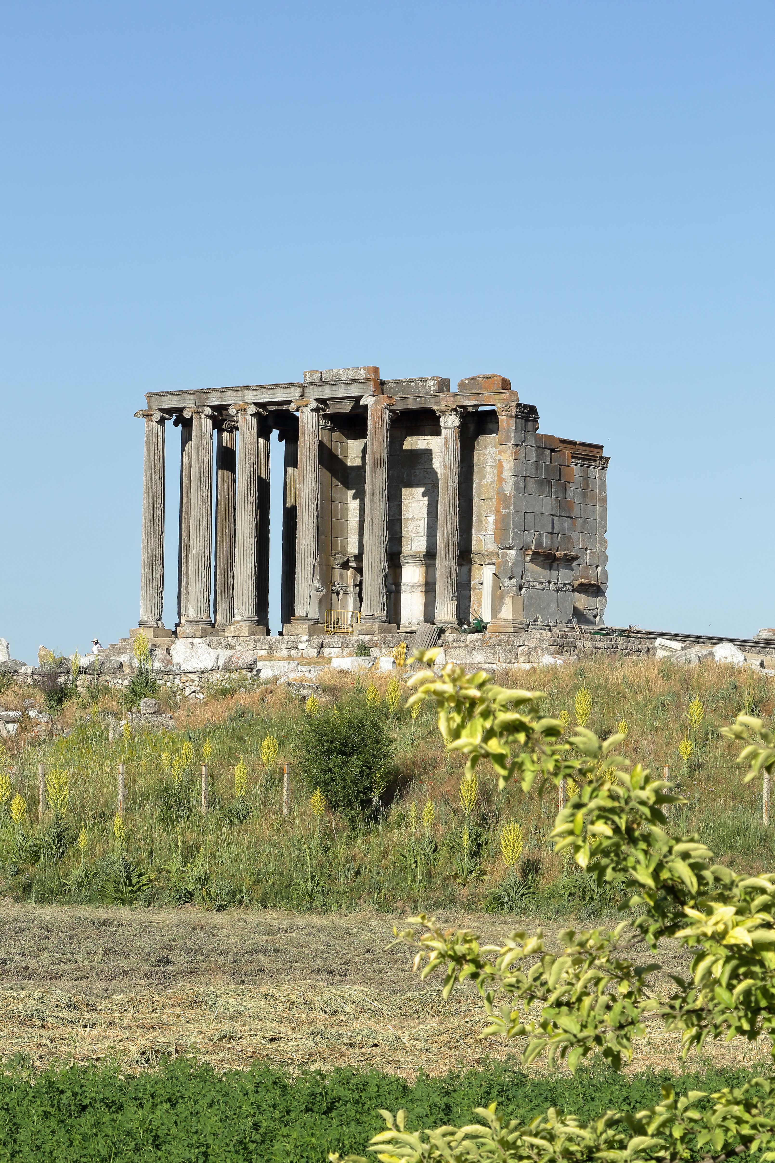 Ancient Roman Temple Ruins in Green Landscape · Free Stock Photo