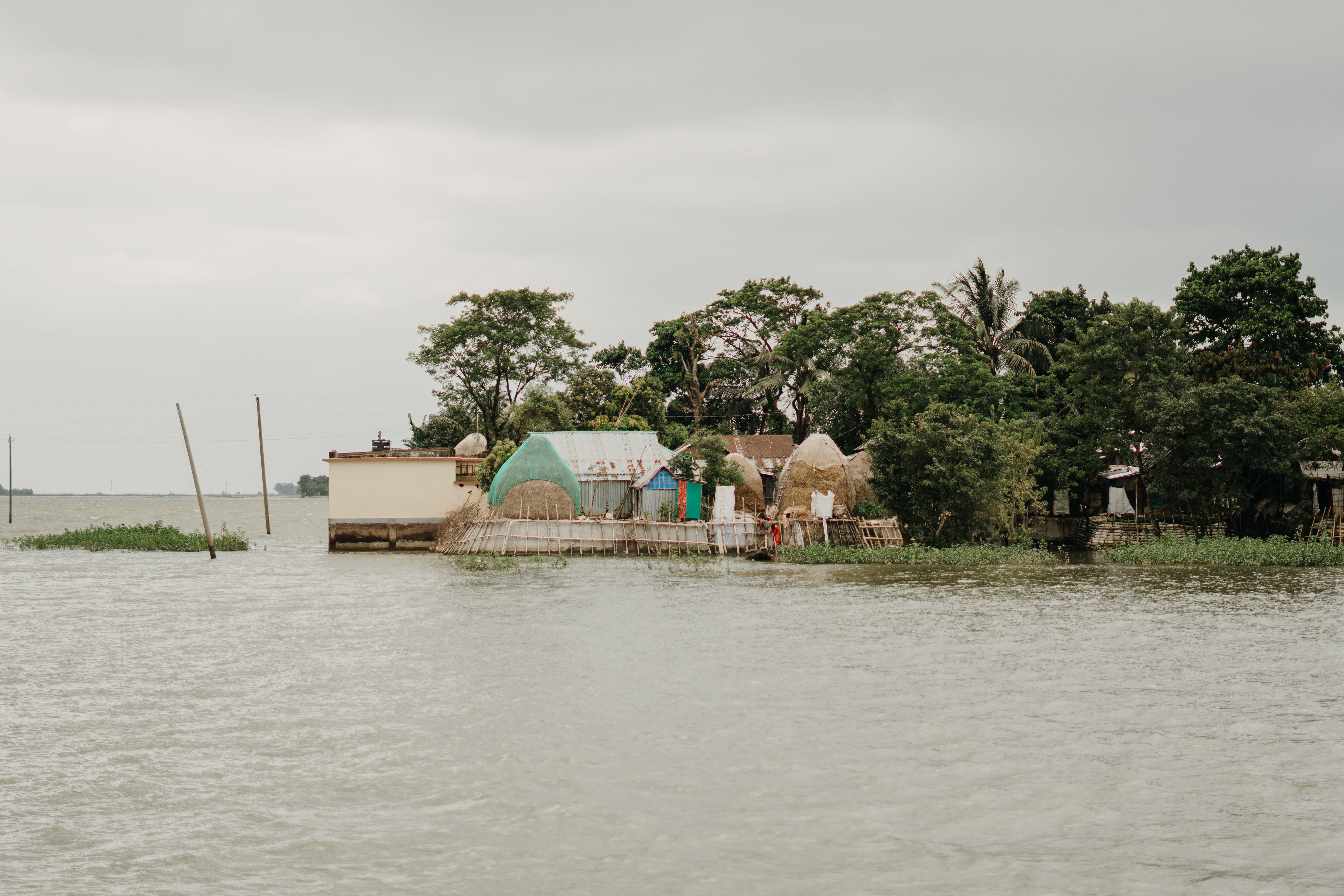 Rural Island Settlement Amidst Flooded Waters · Free Stock Photo