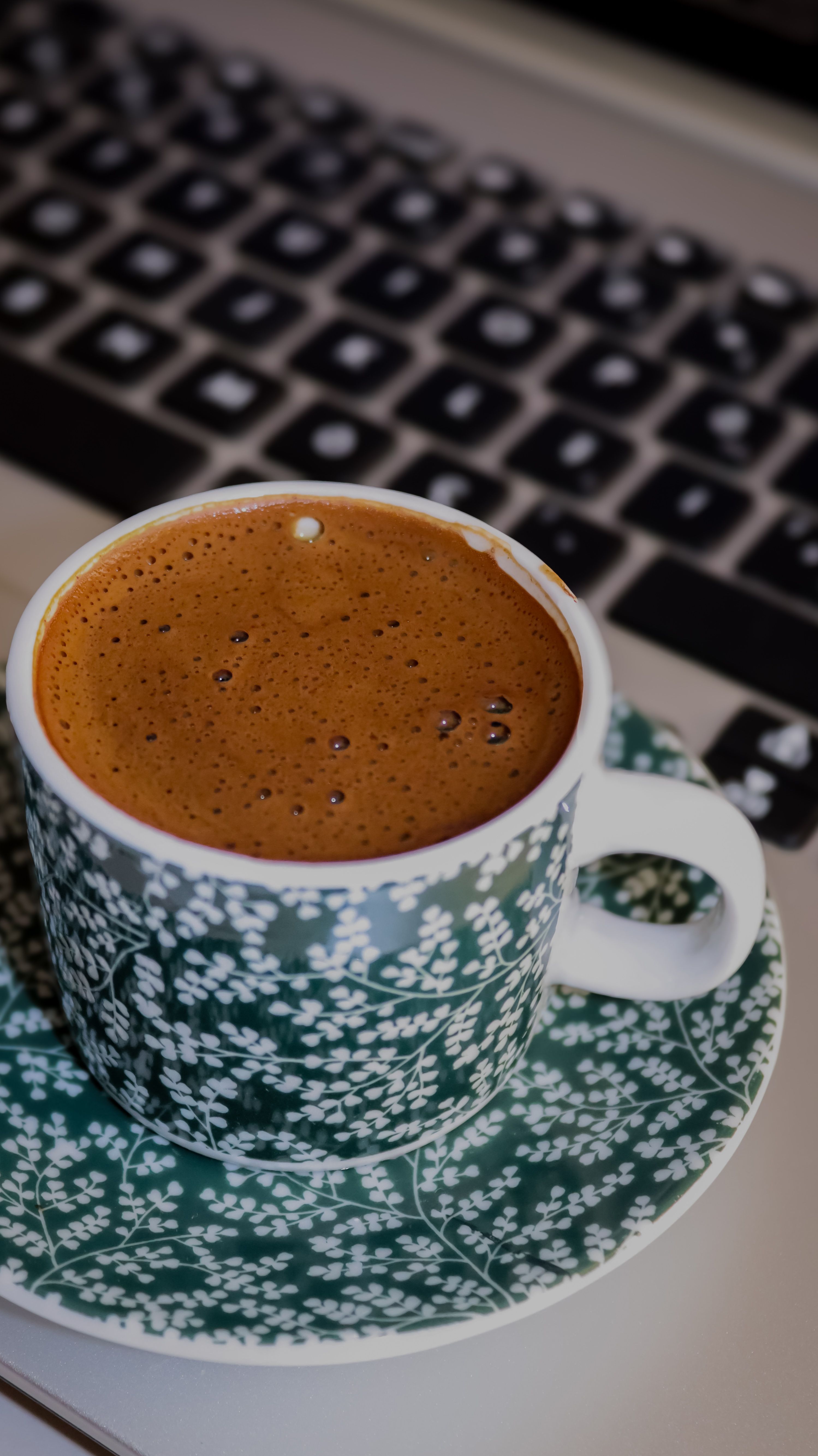 Elegant Floral Cup of Coffee on Desk · Free Stock Photo