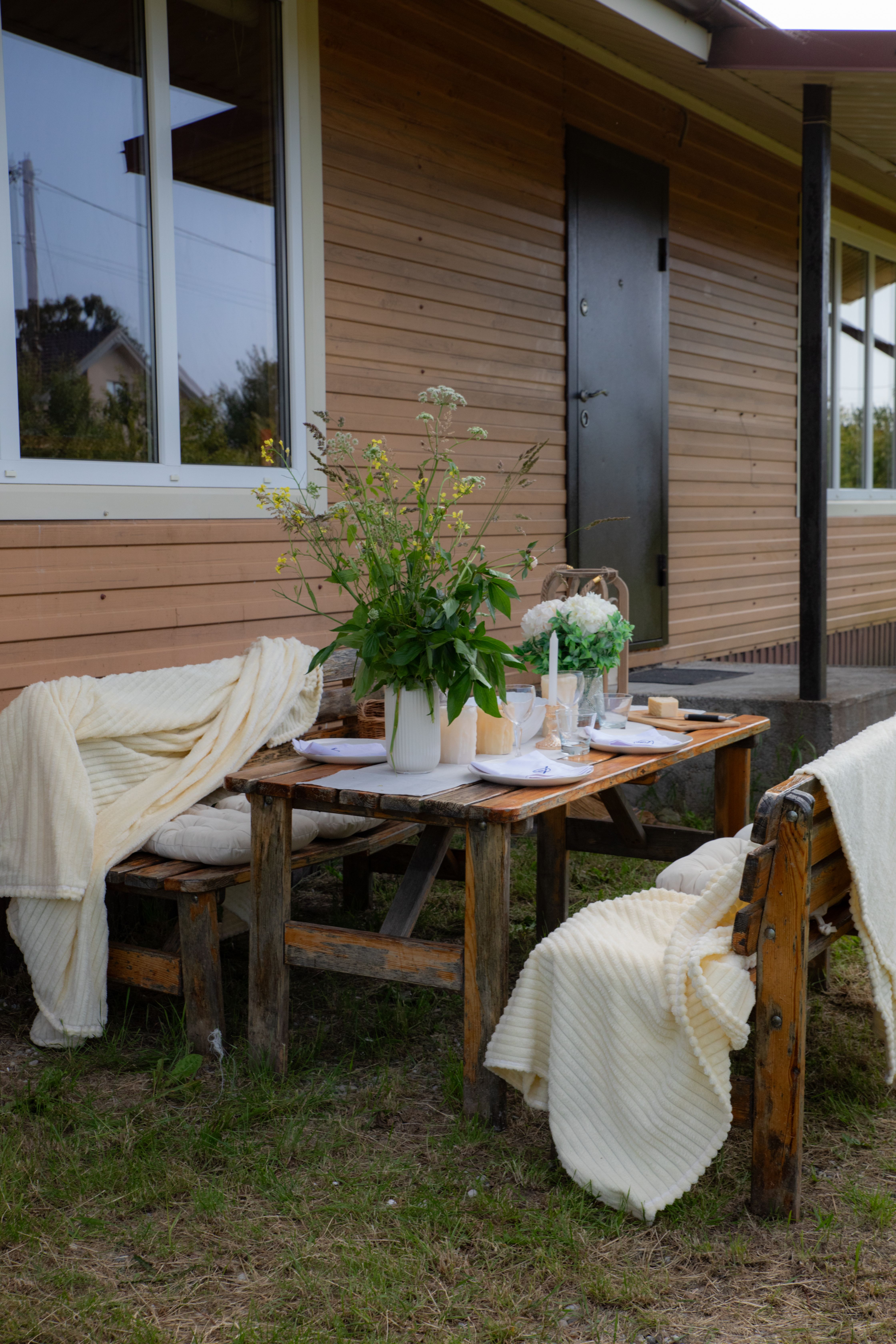 Cozy Outdoor Rustic Dining Setup by Cottage · Free Stock Photo
