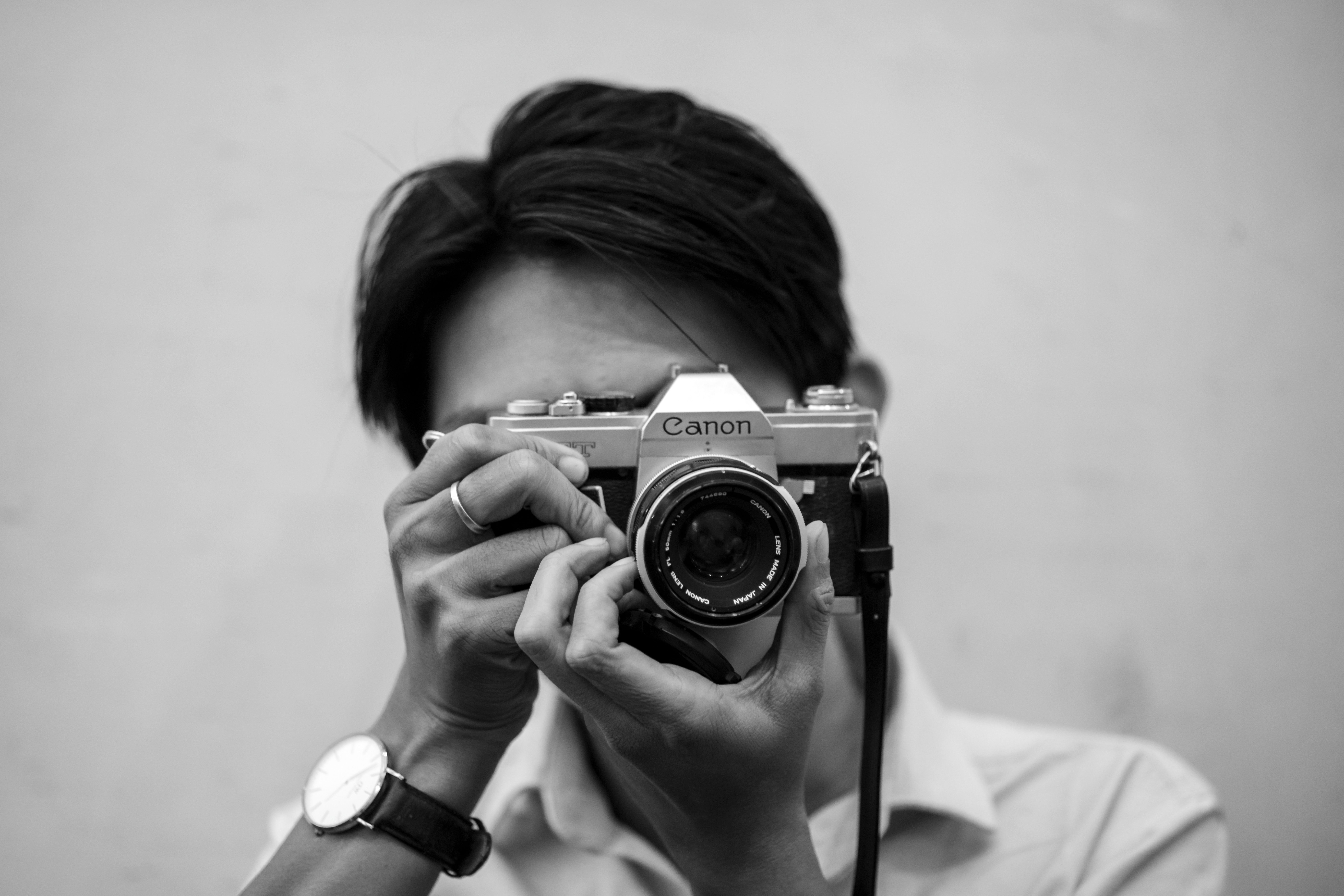 Black and White Portrait of Photographer with Camera · Free Stock Photo