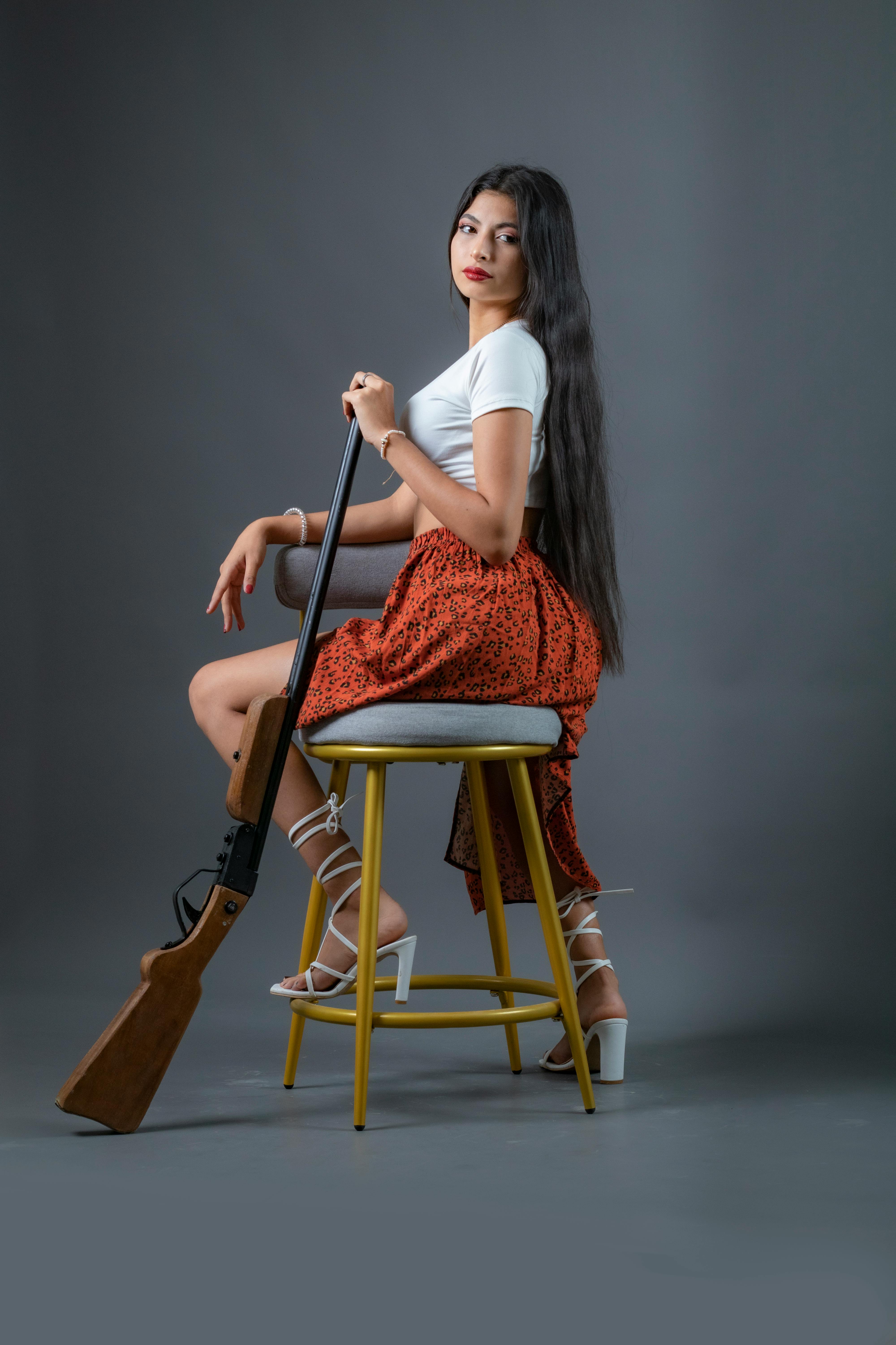 Portrait of Woman Posing with Rifle · Free Stock Photo
