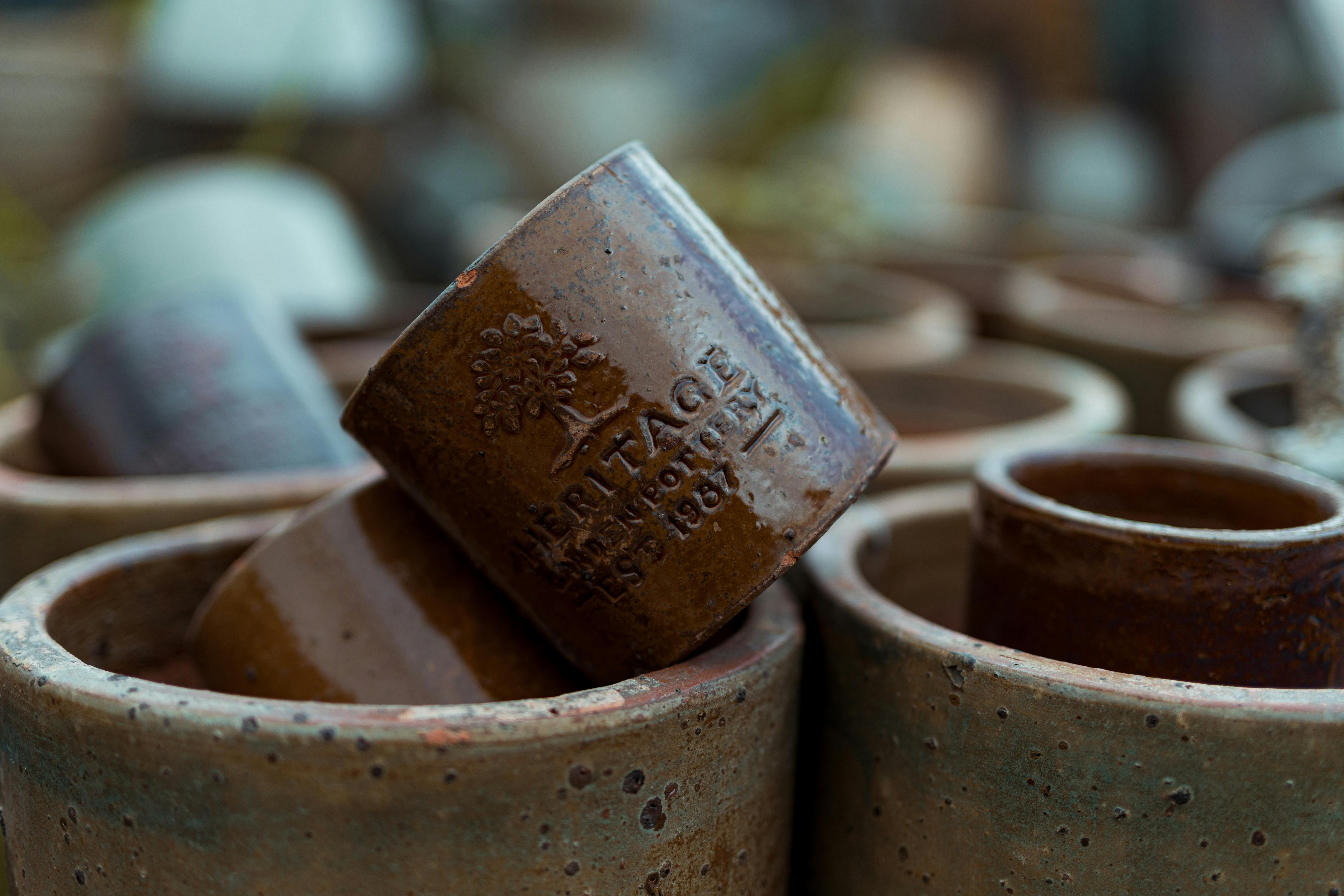 Vintage Ceramic Pots with Heritage Imprint · Free Stock Photo