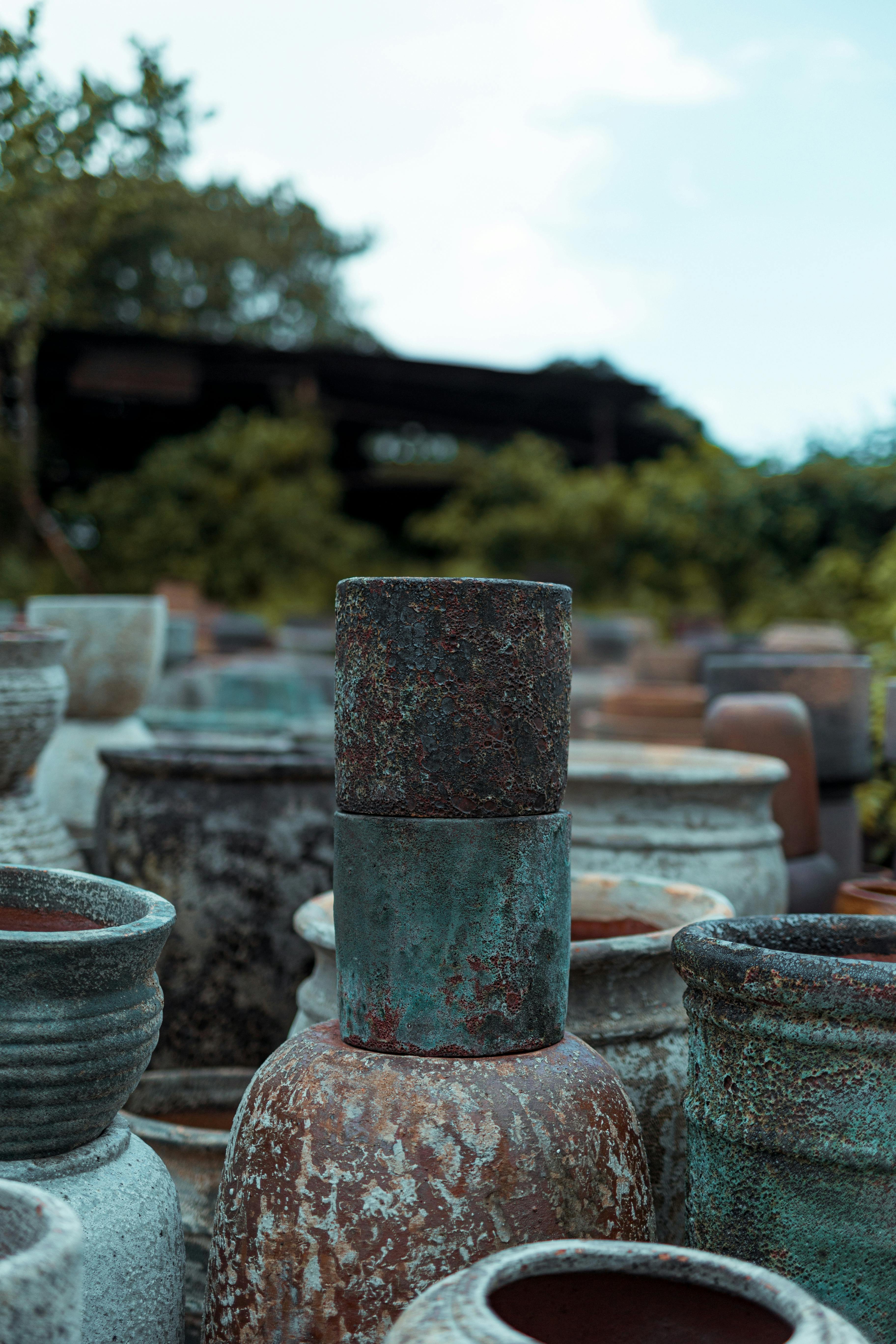 Rustic Ceramic Pots in Vietnam's Outdoors · Free Stock Photo