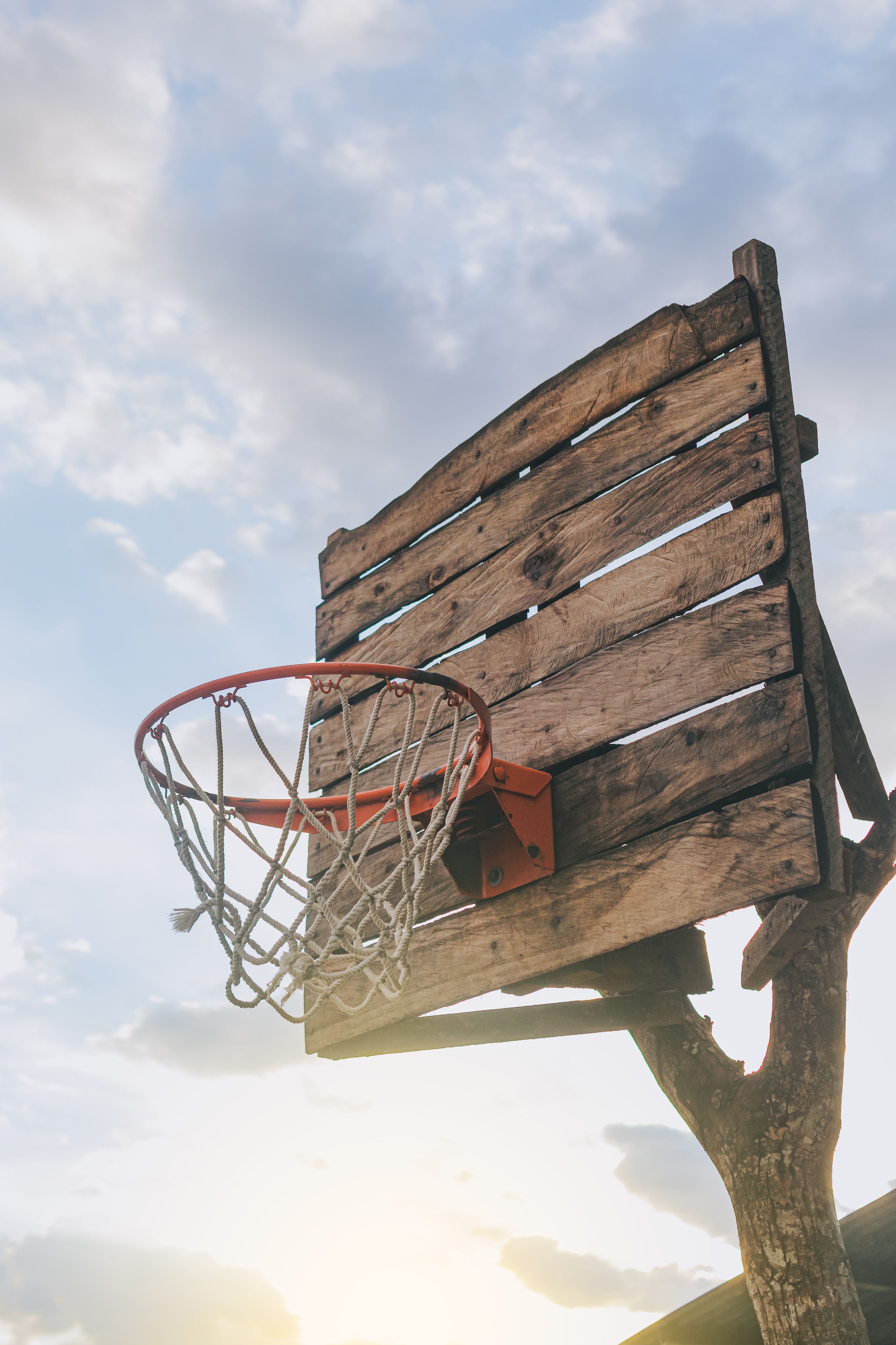 Rustic Wooden Basketball Hoop Against Blue Sky · Free Stock Photo