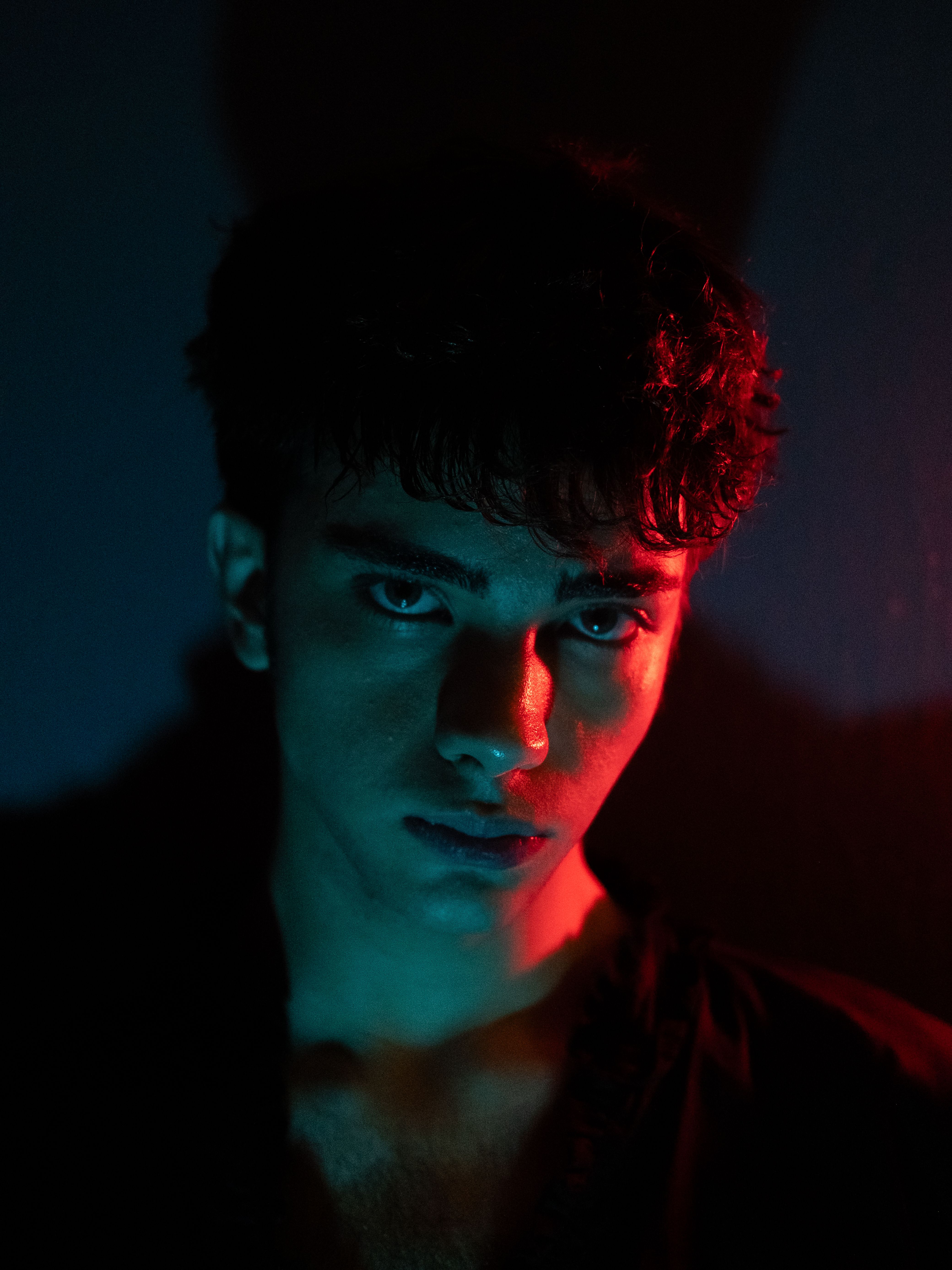 Moody Portrait of Young Man with Dramatic Lighting · Free Stock Photo