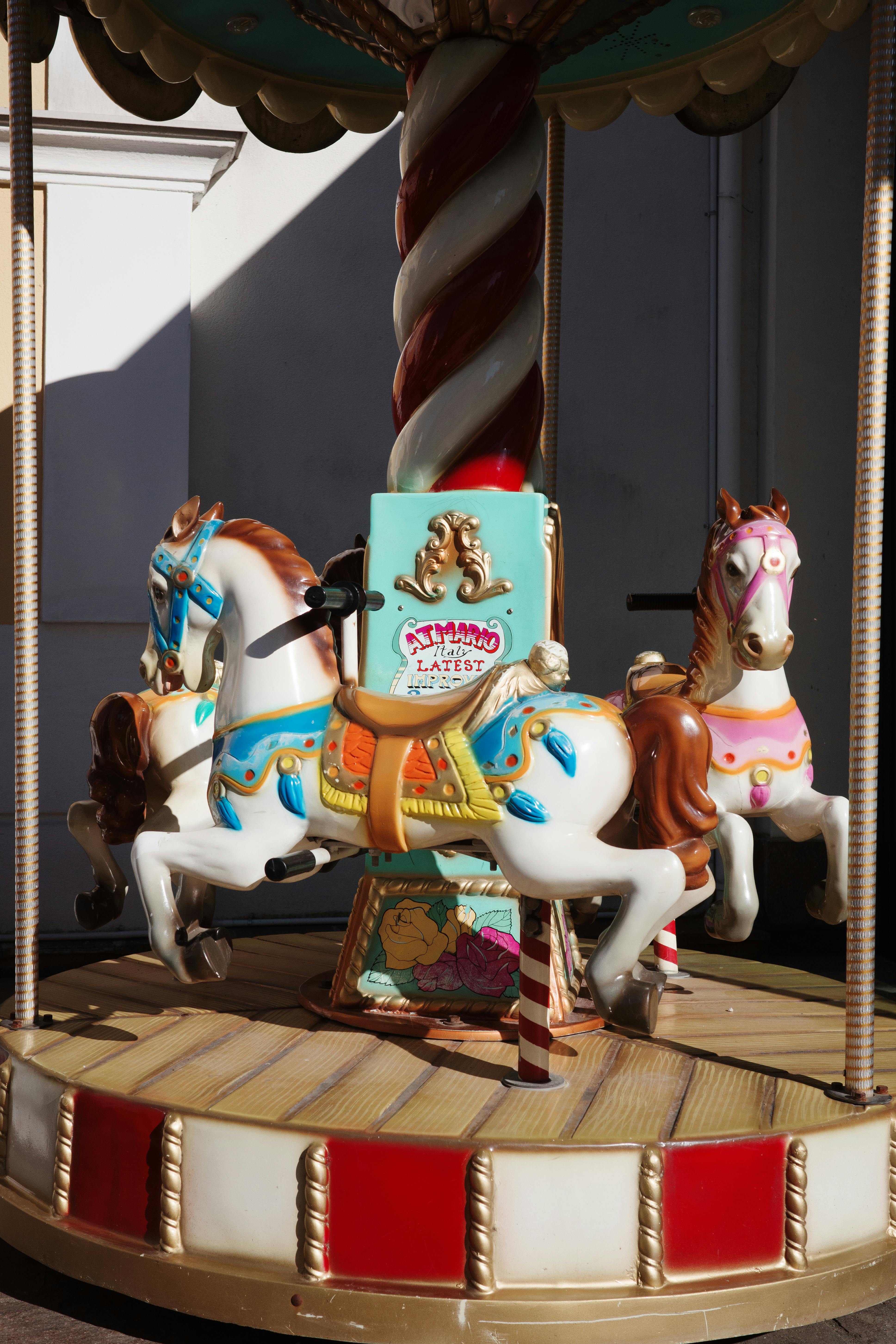 Colorful Carousel Horses in Bruneck, Italy · Free Stock Photo