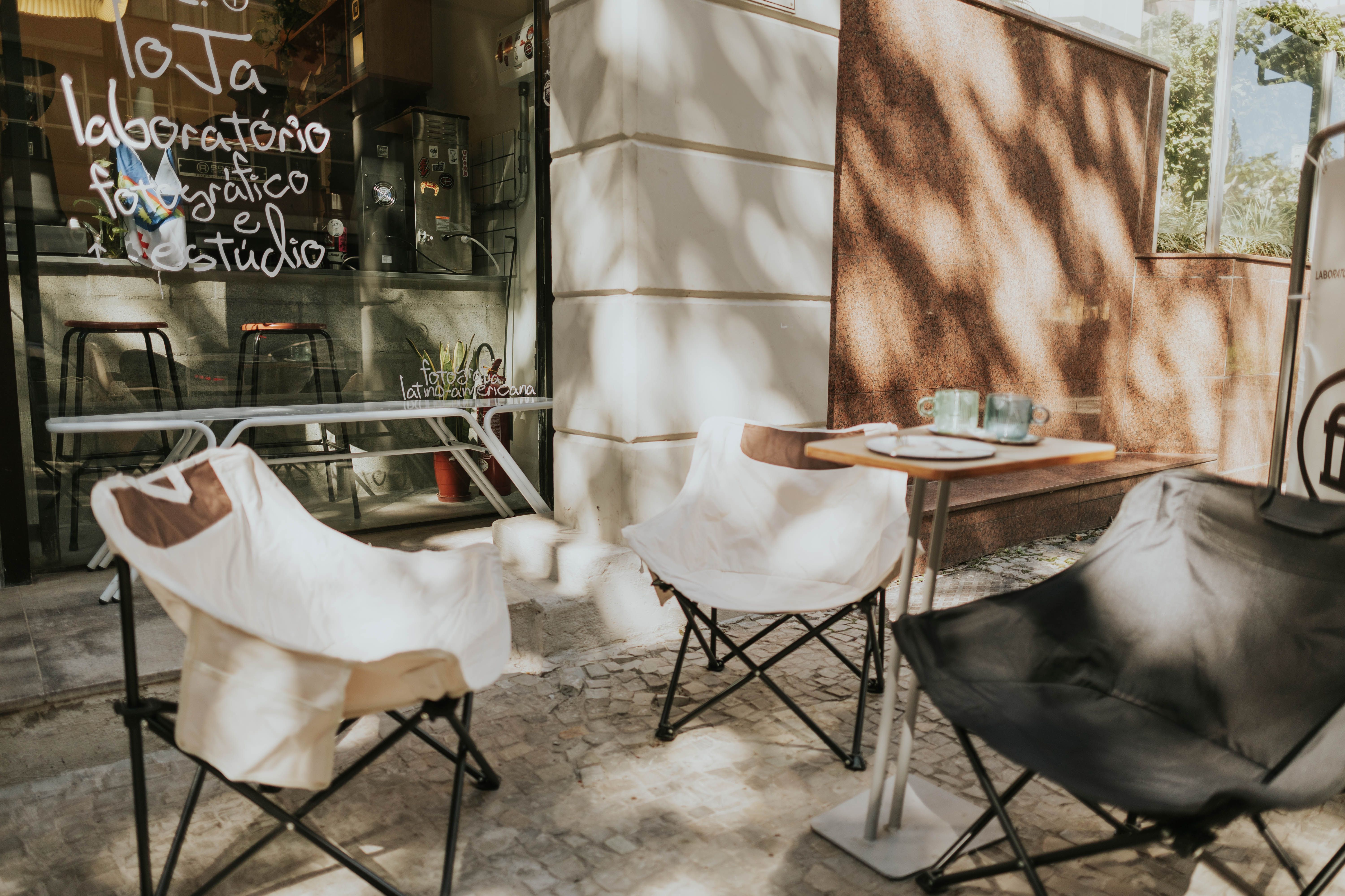 Cozy Outdoor Café Seating in Urban Setting · Free Stock Photo
