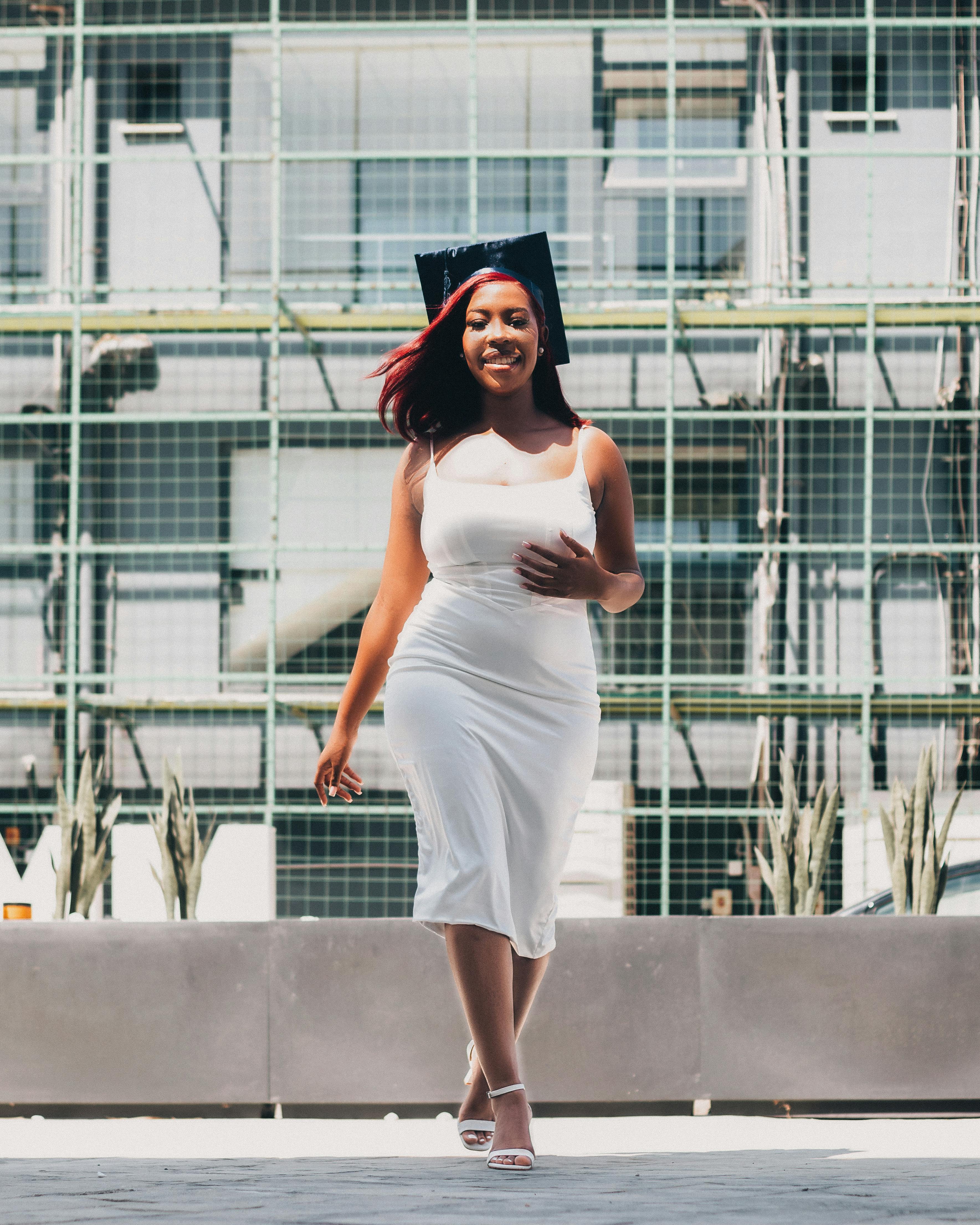 Confident College Graduate in Urban Setting · Free Stock Photo