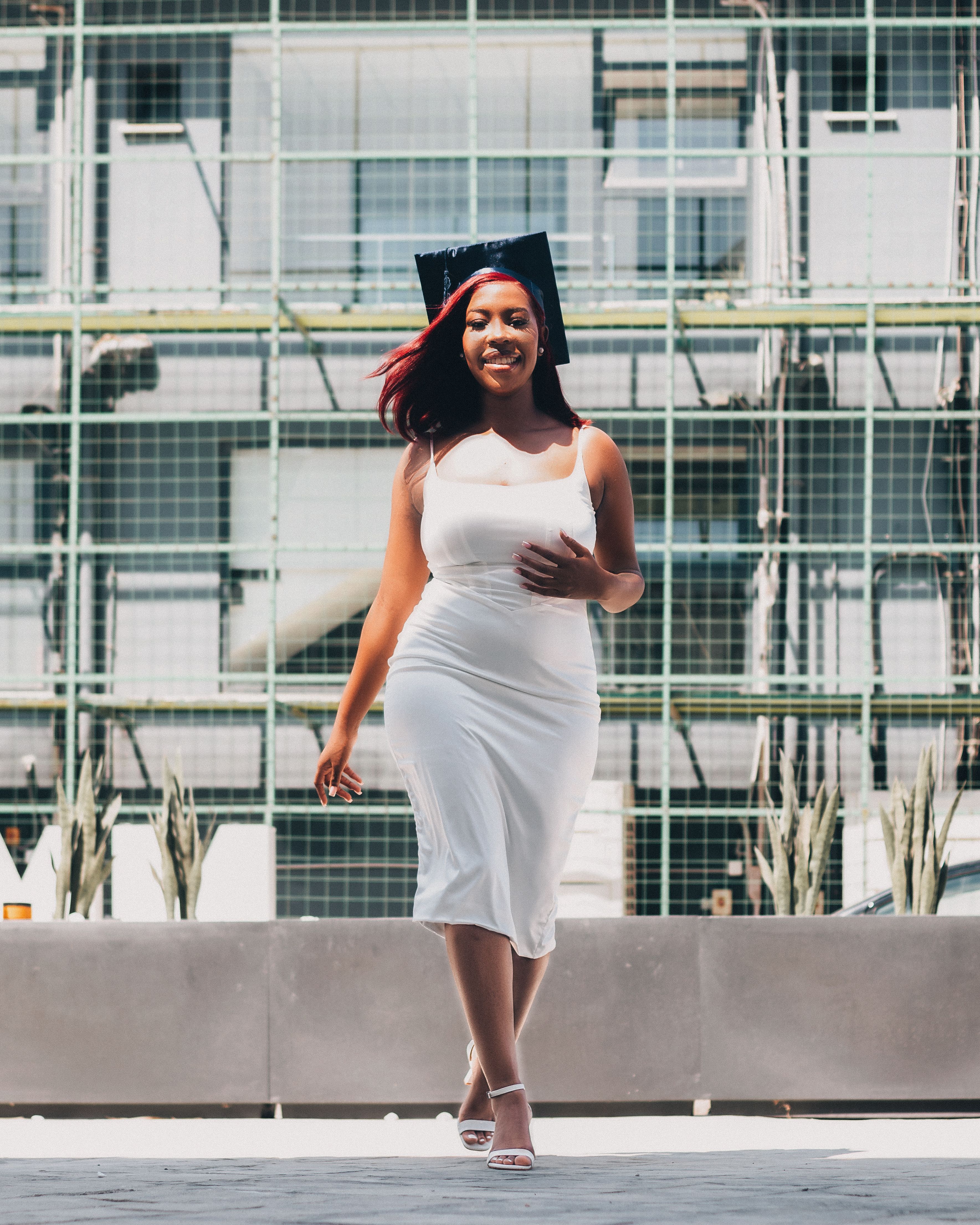 Confident College Graduate in Urban Setting · Free Stock Photo