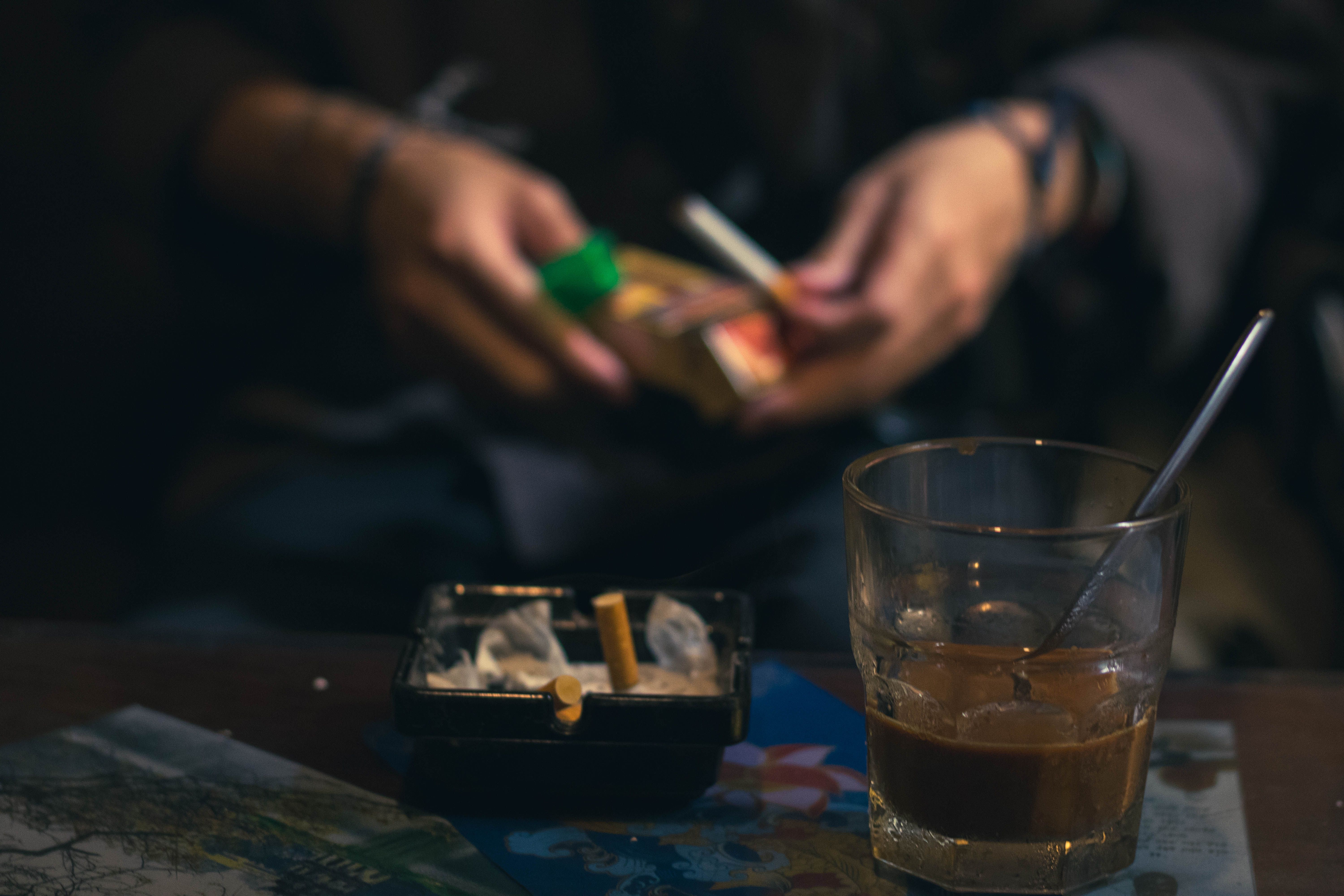 Casual Coffee and Cigarette Break Indoors · Free Stock Photo