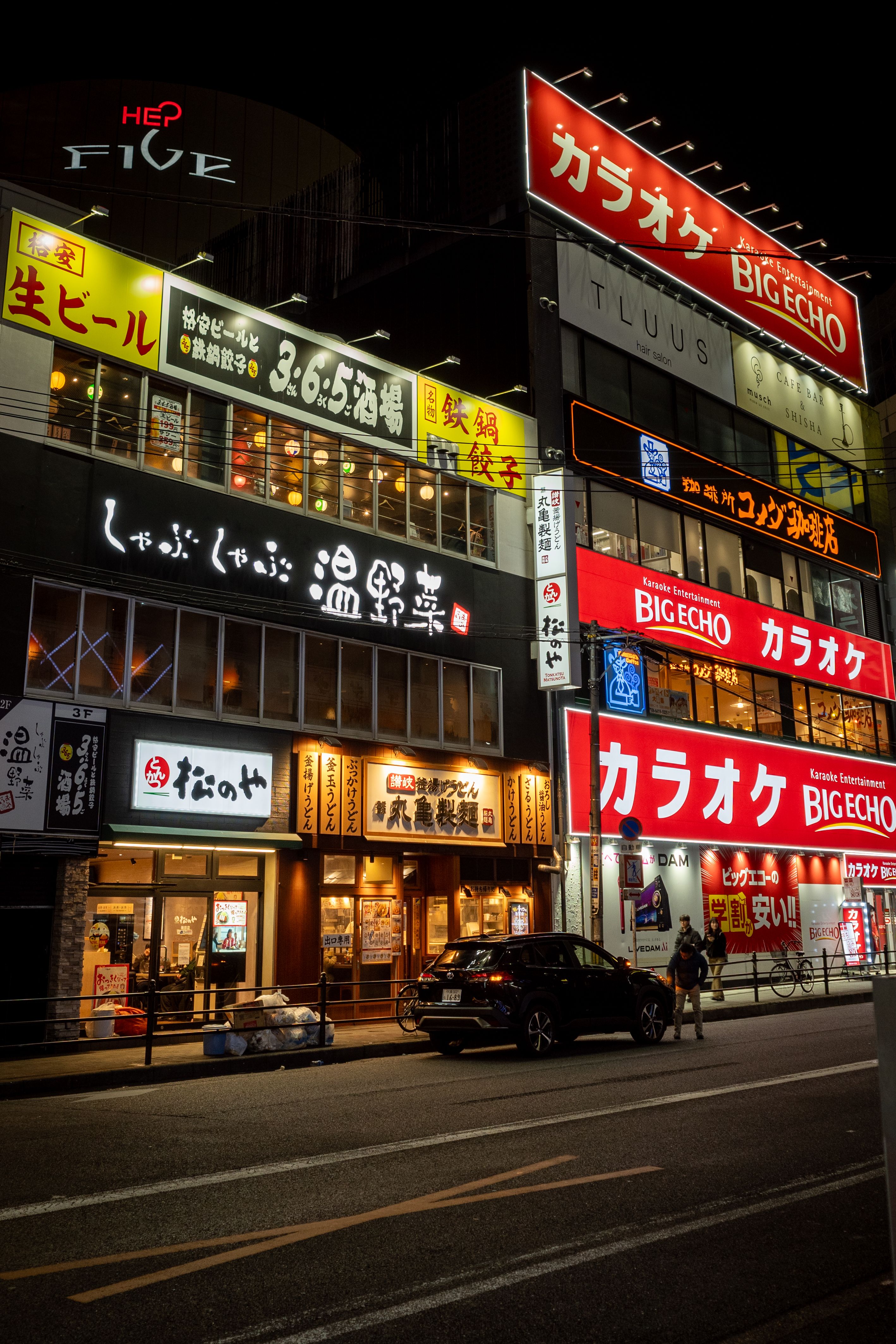 Nightlife in Osaka: Vibrant Street with Neon Signs · Free Stock Photo