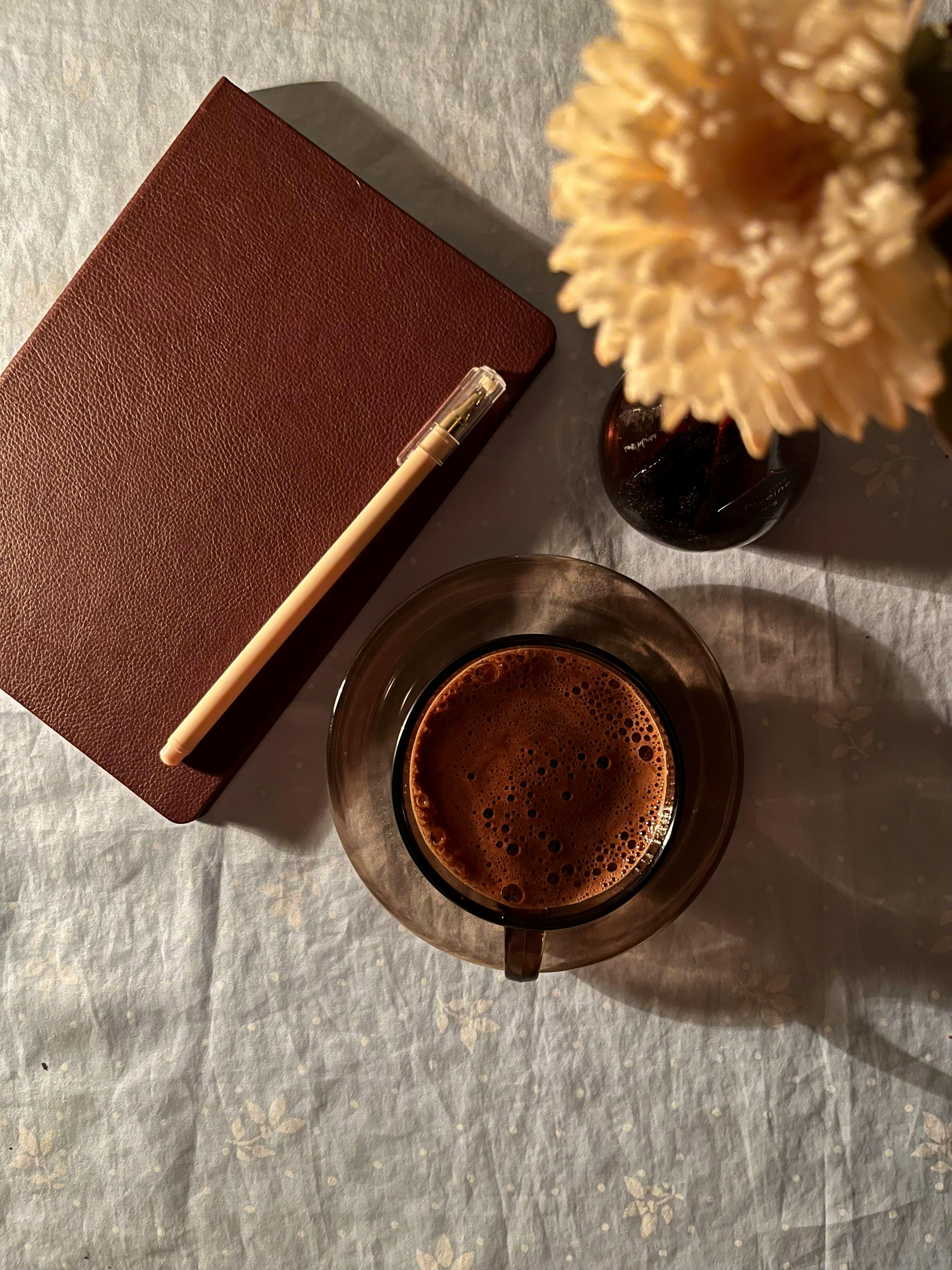 Elegant Flat Lay with Coffee and Journal on Table · Free Stock Photo