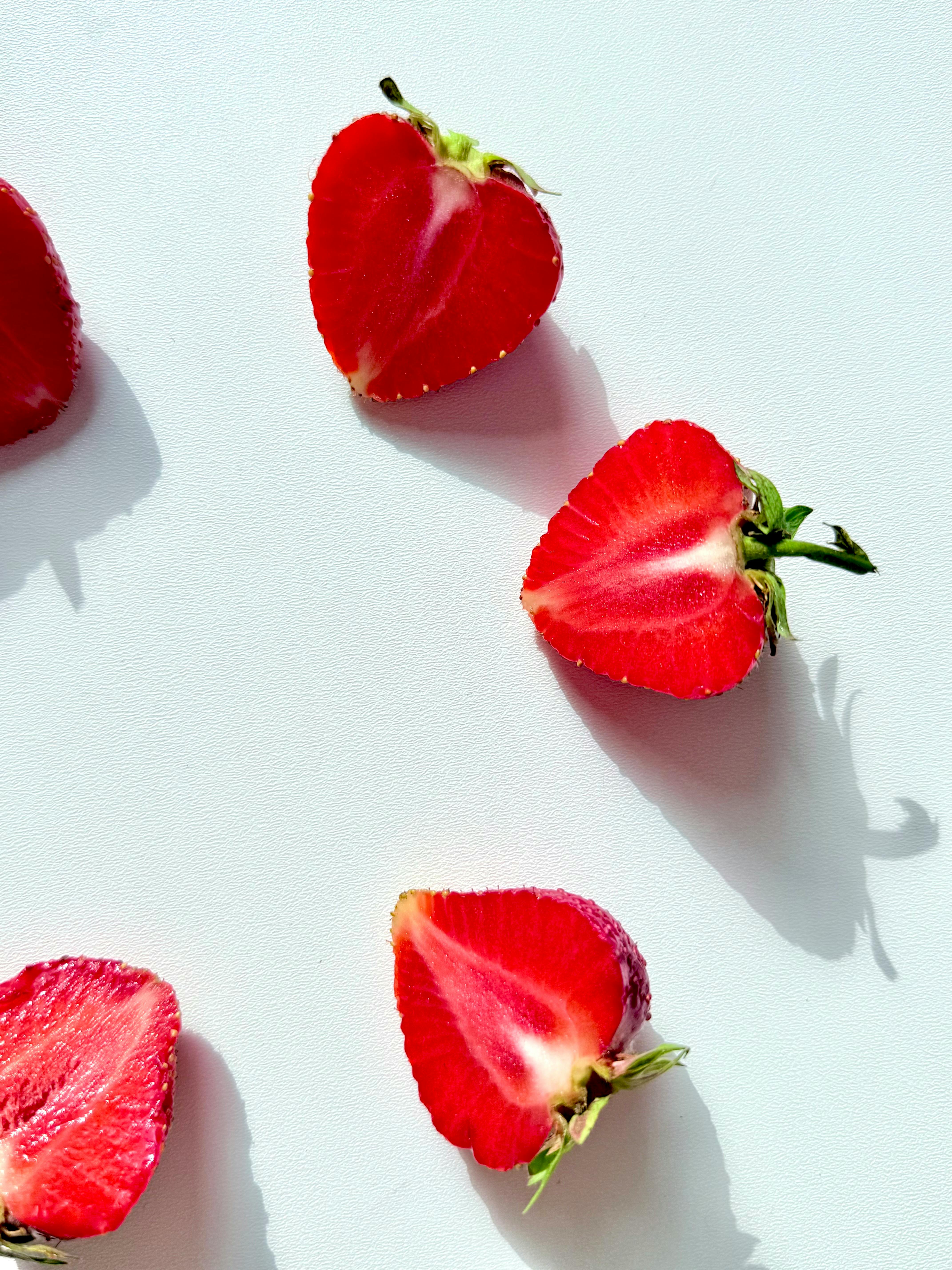 Fresh Strawberry Halves in Bright Light · Free Stock Photo