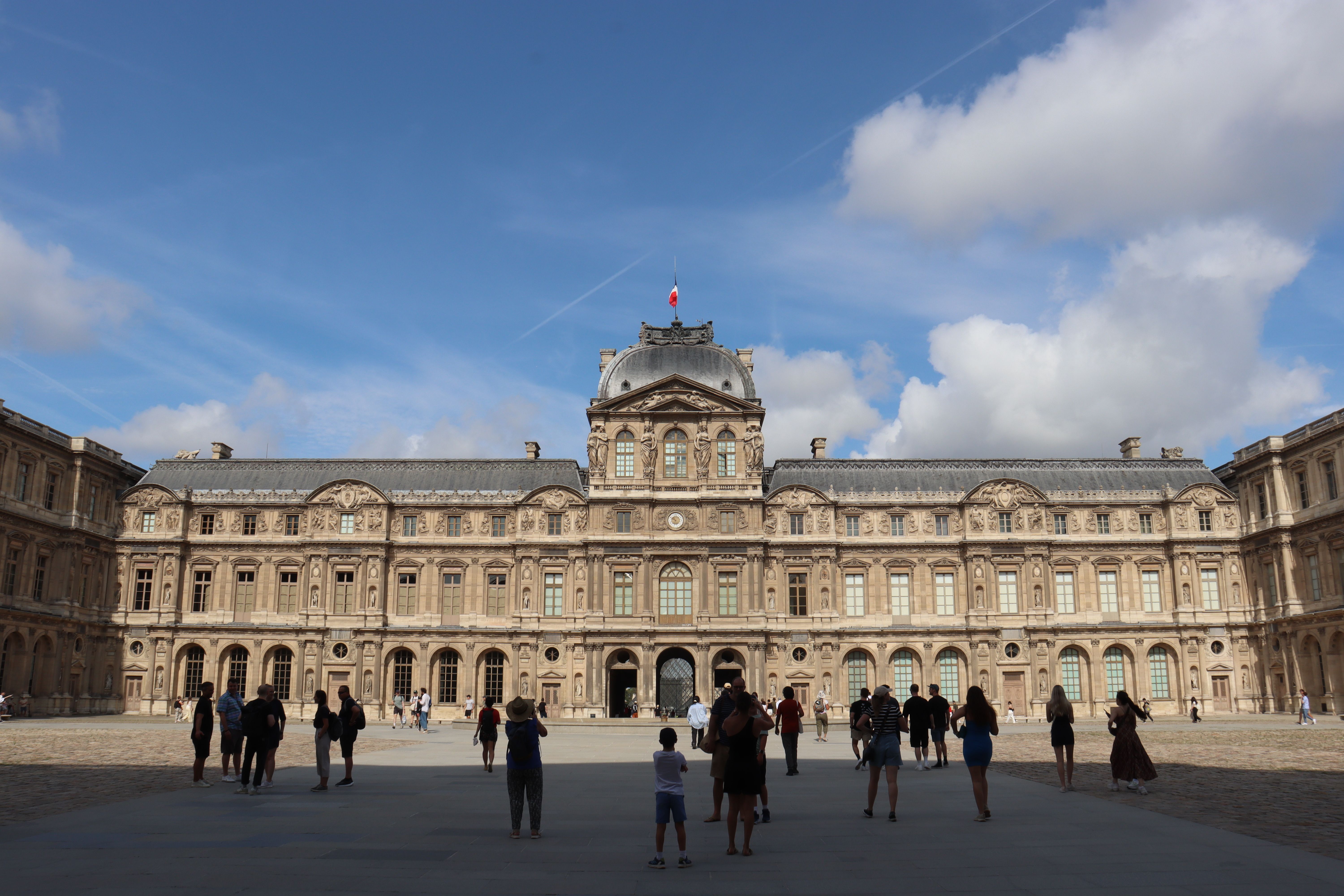 Louvre Museum Paris facade with visitors · Free Stock Photo