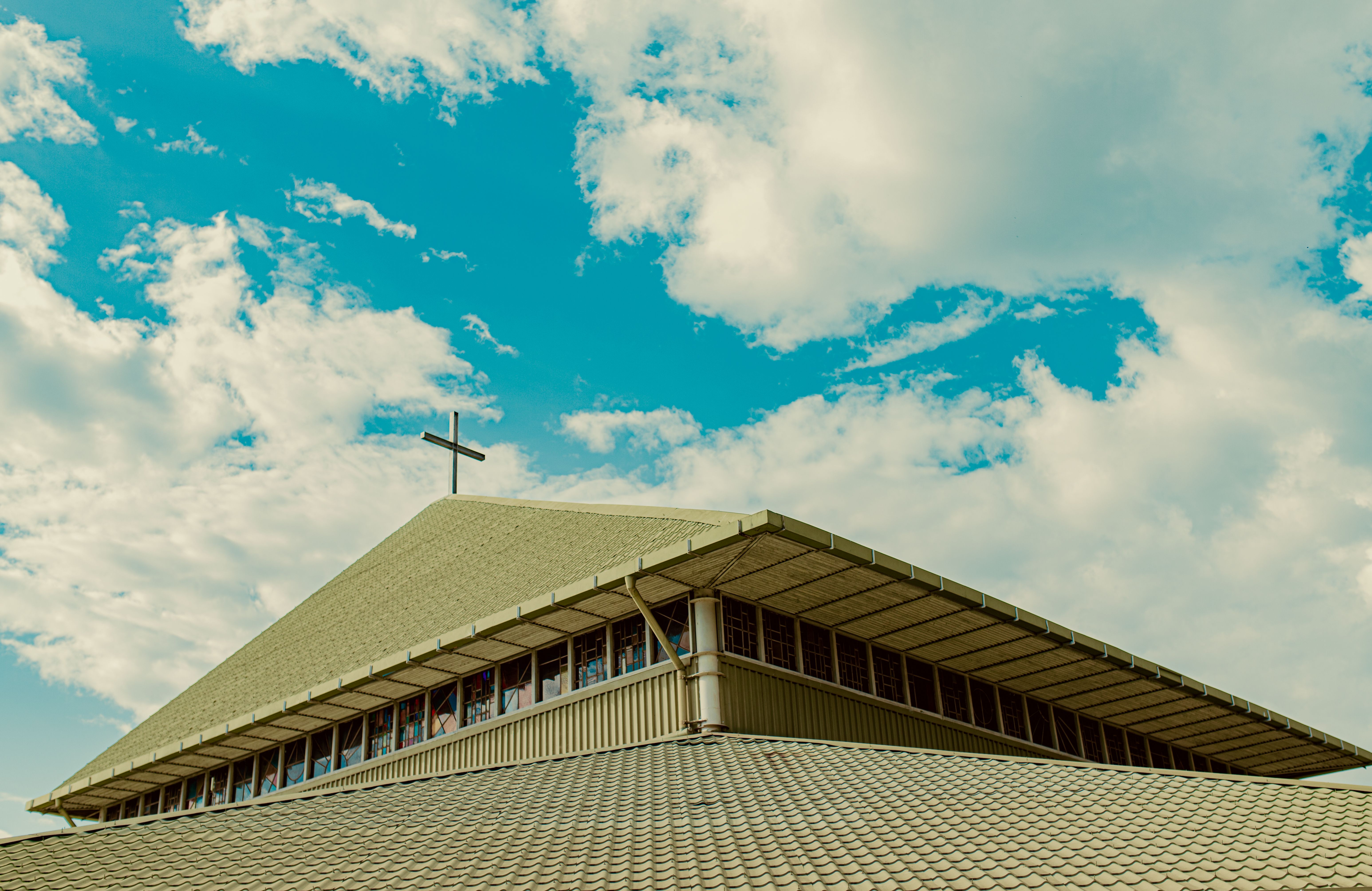 Modern Church Roof Against Blue Sky · Free Stock Photo