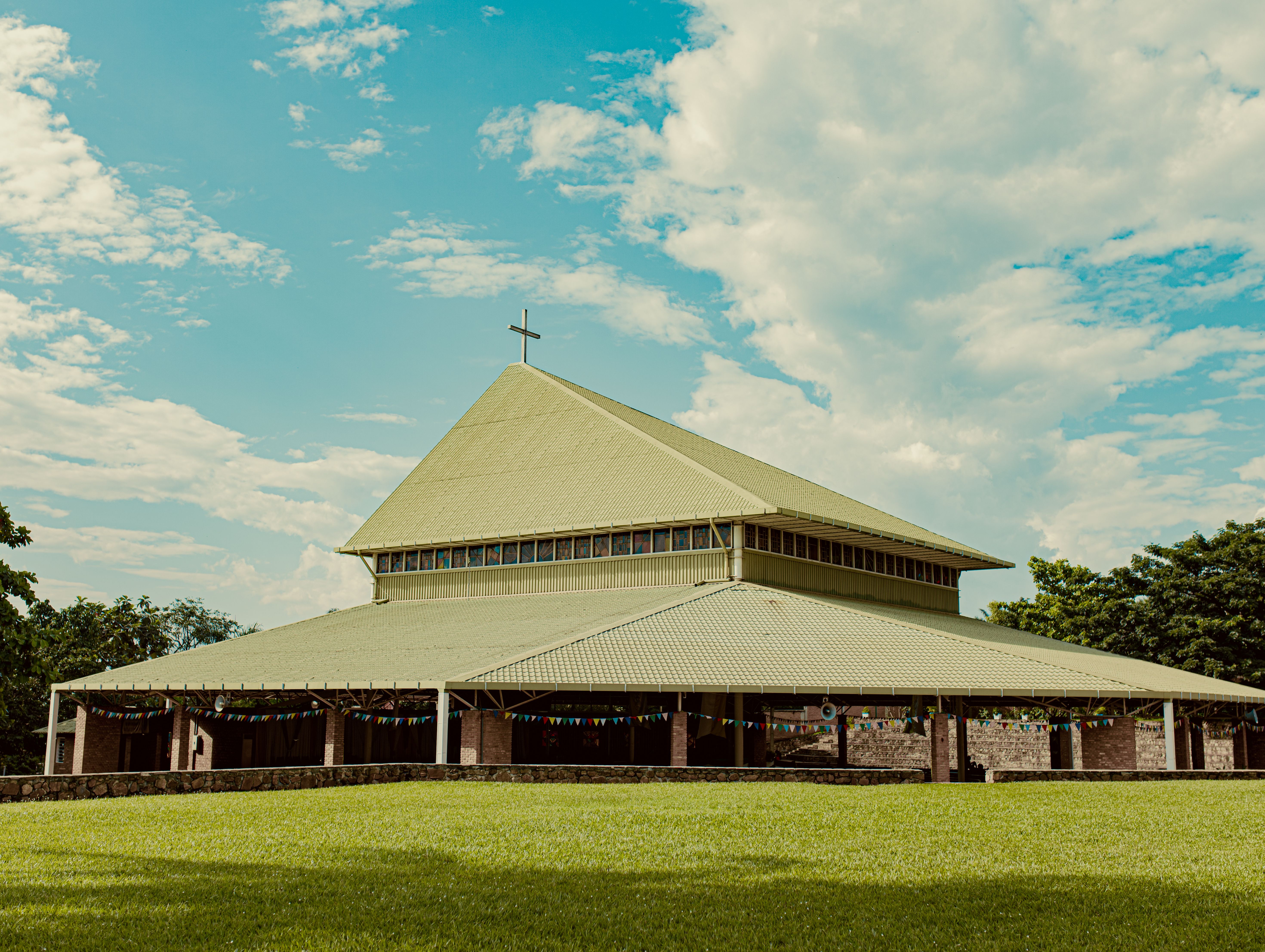 Spacious Church Building with Cross in Open Field · Free Stock Photo