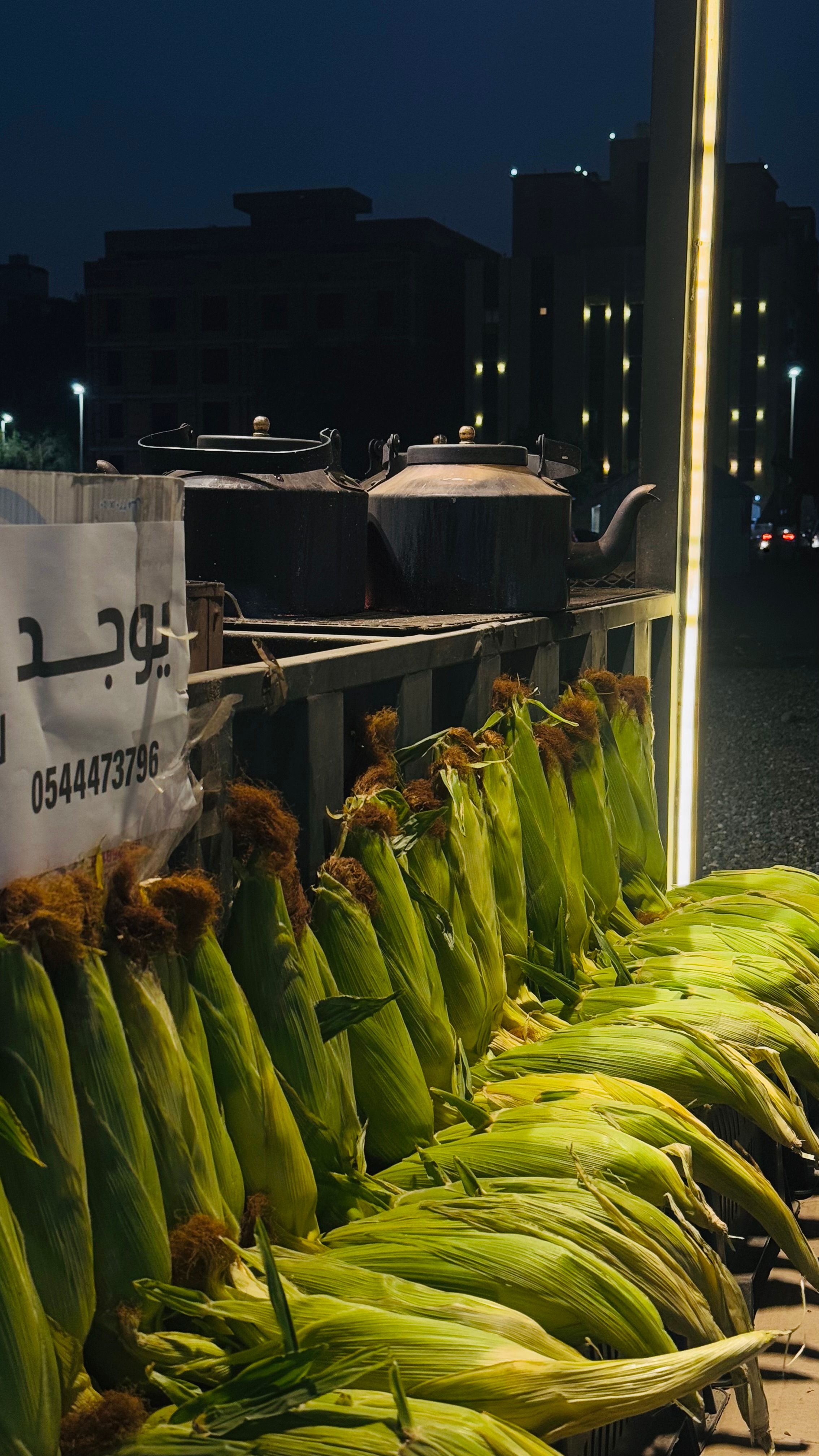 Street Market Fresh Corn Display at Night · Free Stock Photo