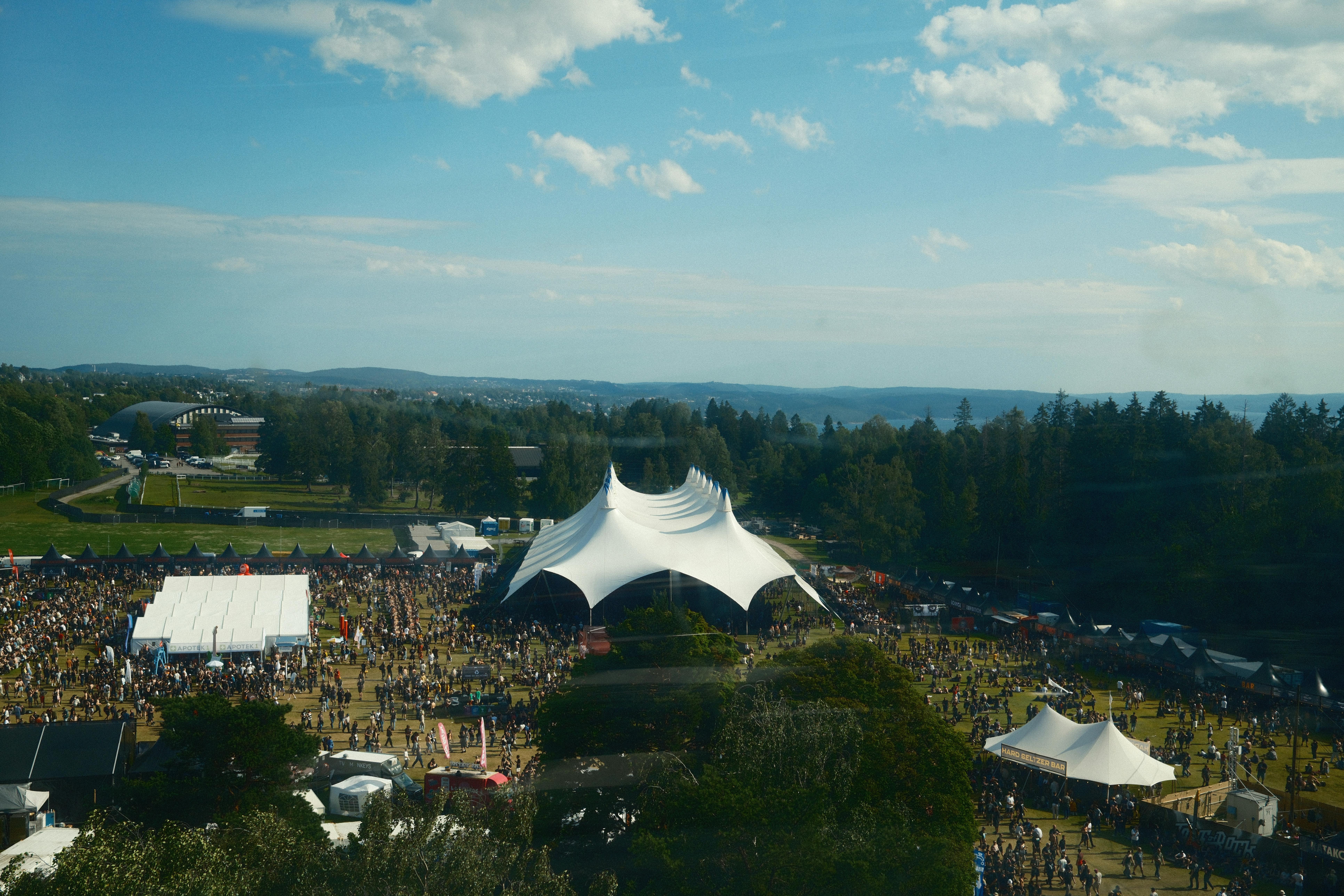 Aerial View of Outdoor Music Festival with Tents · Free Stock Photo