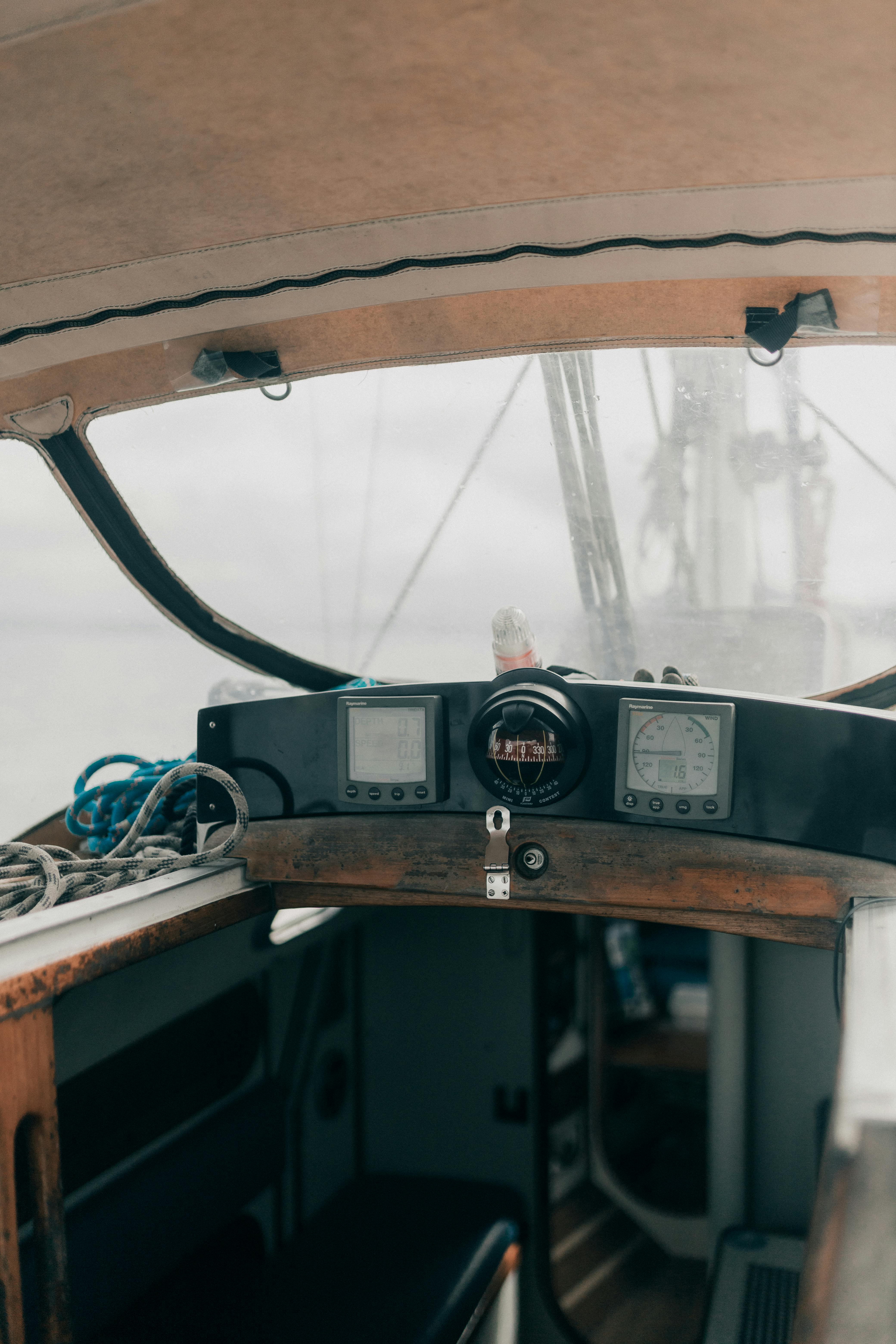 Vintage Sailboat Cockpit with Nautical Instruments · Free Stock Photo