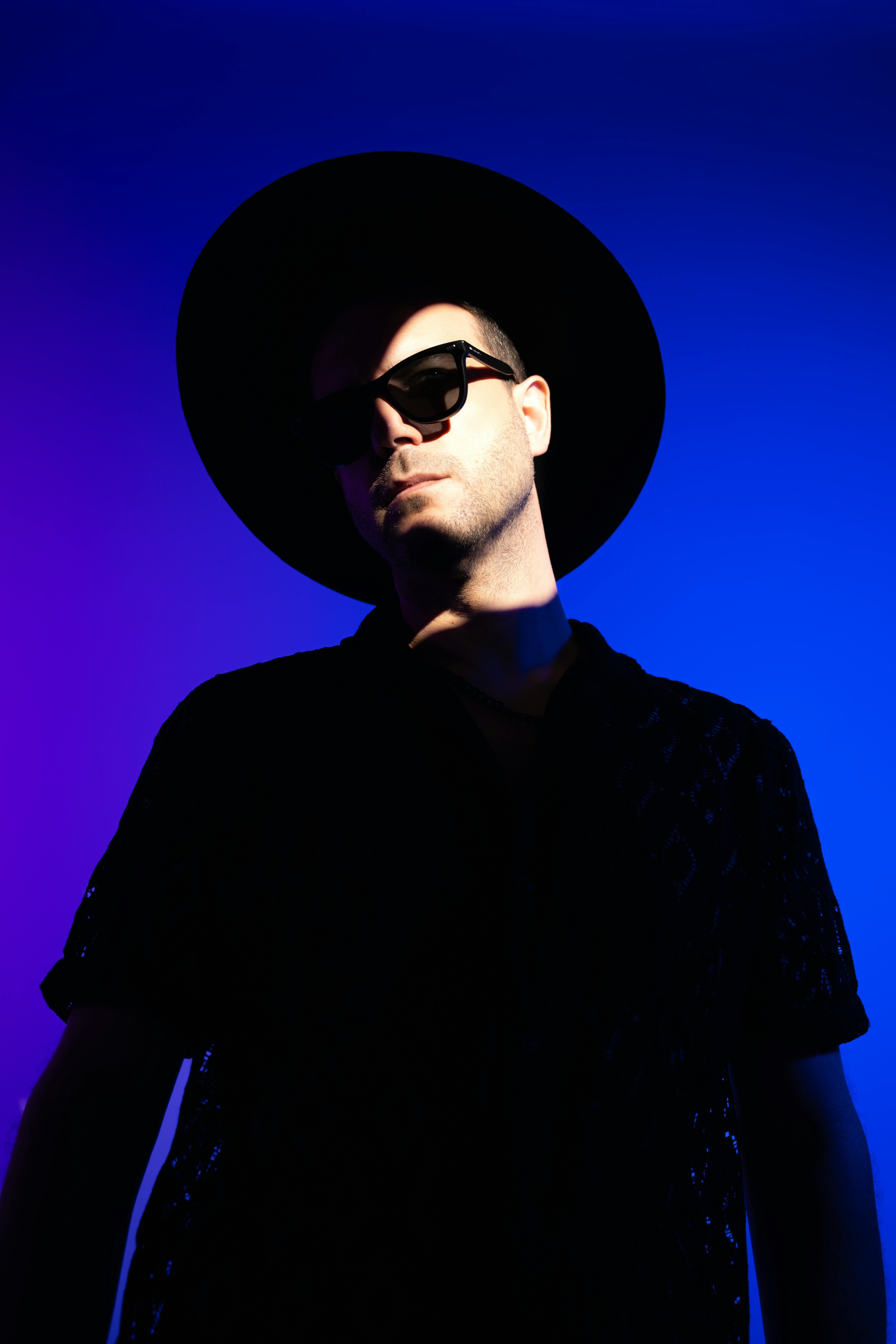 Bold Fashion Portrait with Dramatic Blue Lighting · Free Stock Photo