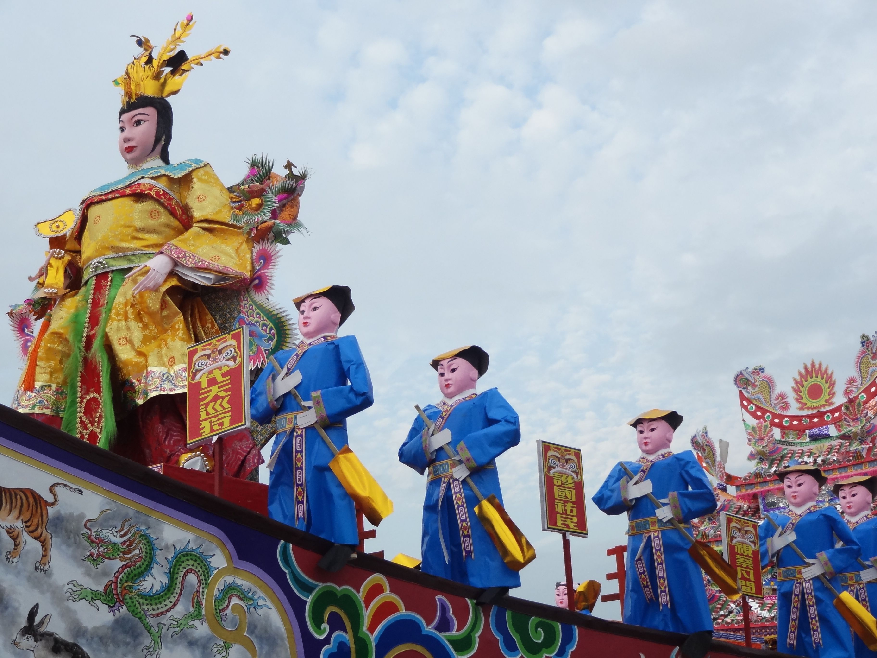 Traditional Asian Festival Parade with Colorful Figures · Free Stock Photo