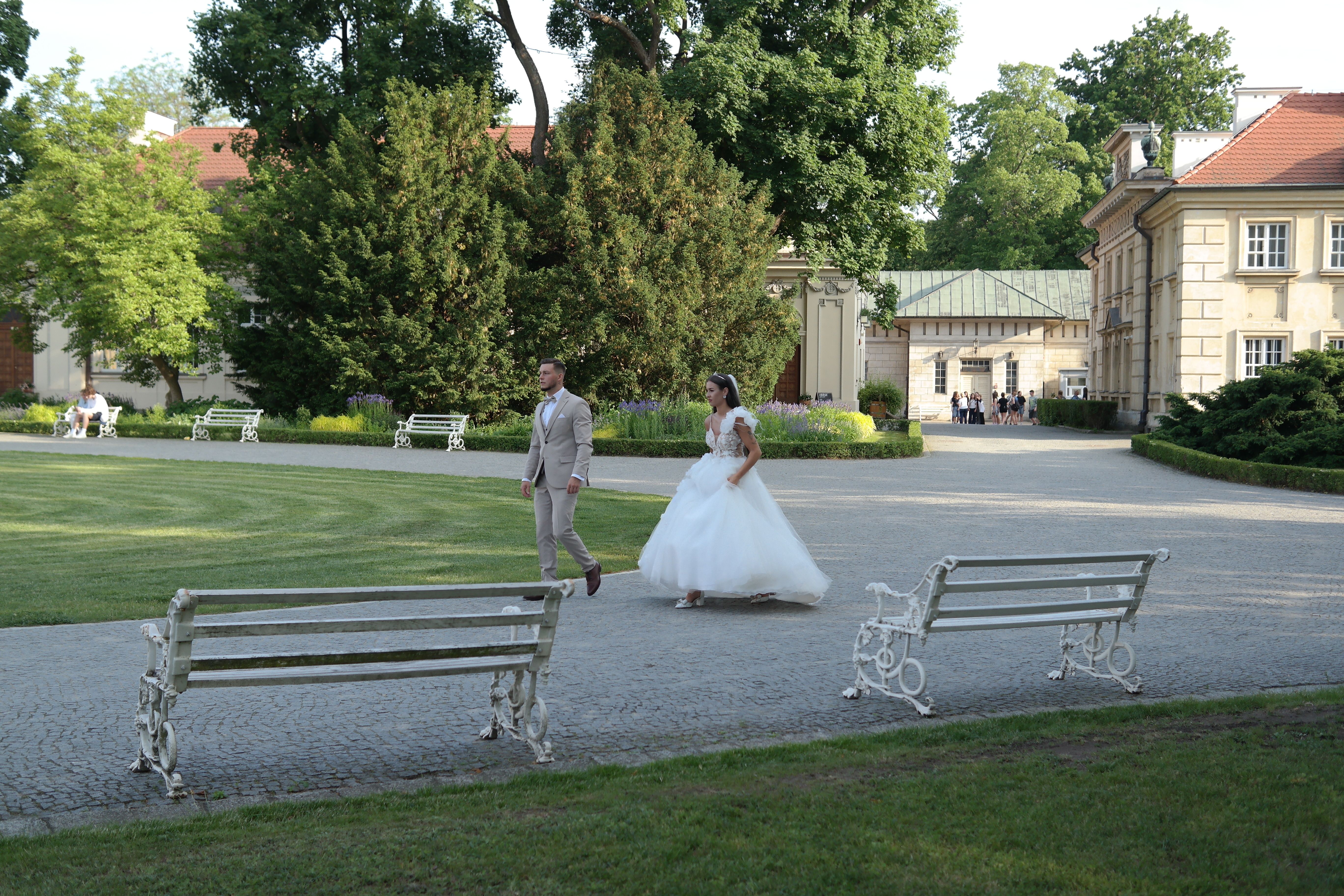 Elegant Outdoor Wedding Walk in Scenic Park · Free Stock Photo