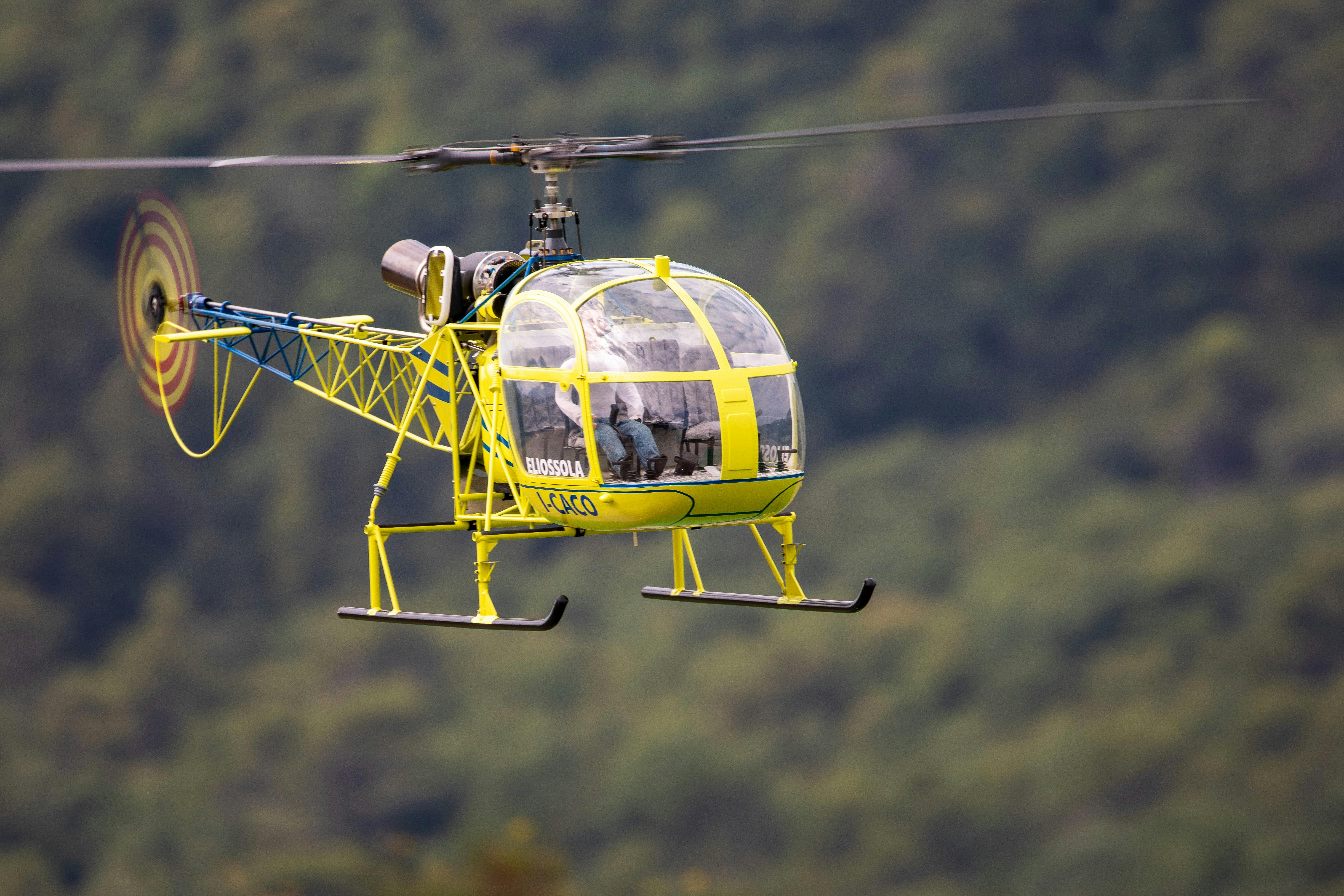 Vintage Yellow Helicopter in Flight · Free Stock Photo