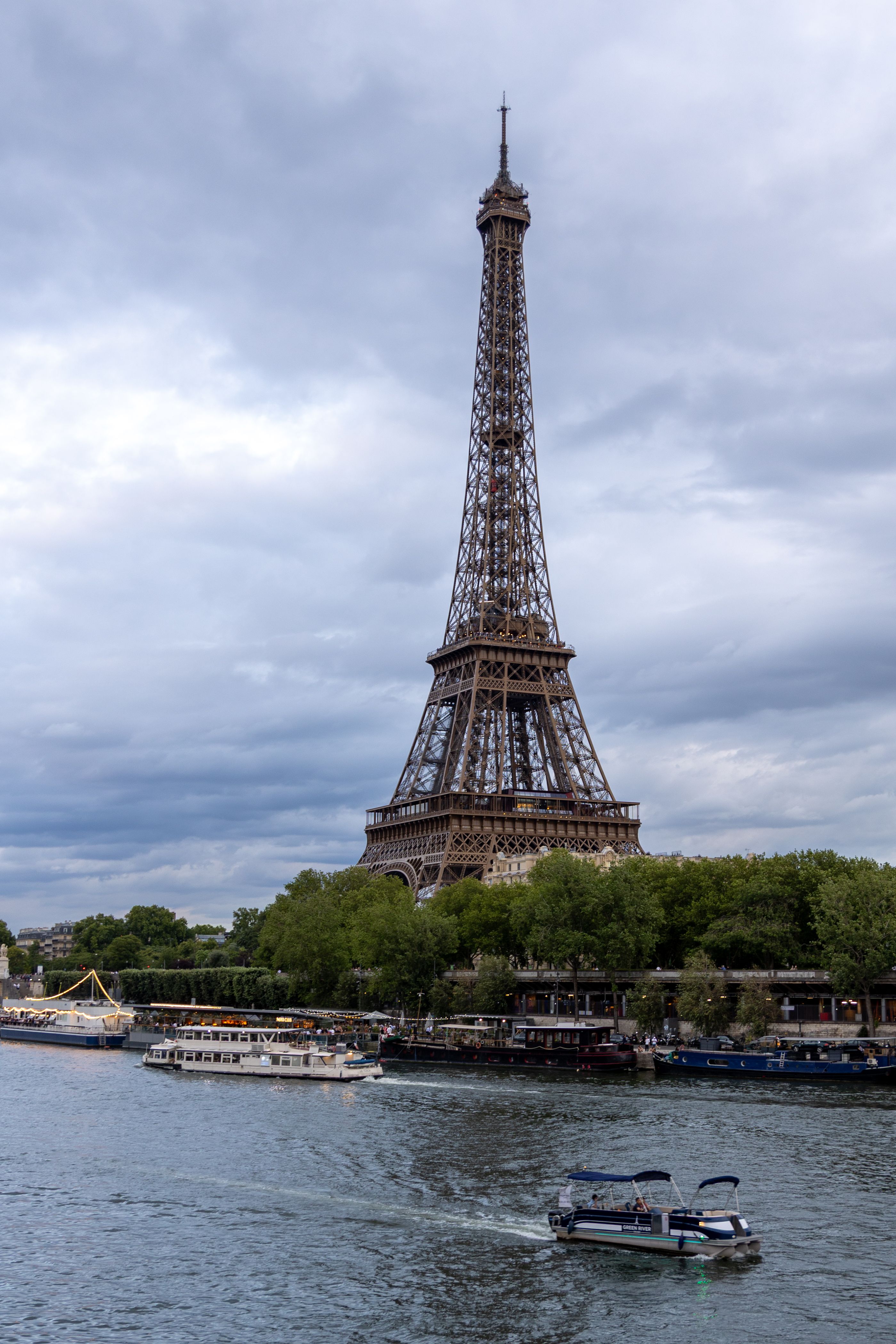 Iconic Eiffel Tower Overlooking the Seine River · Free Stock Photo