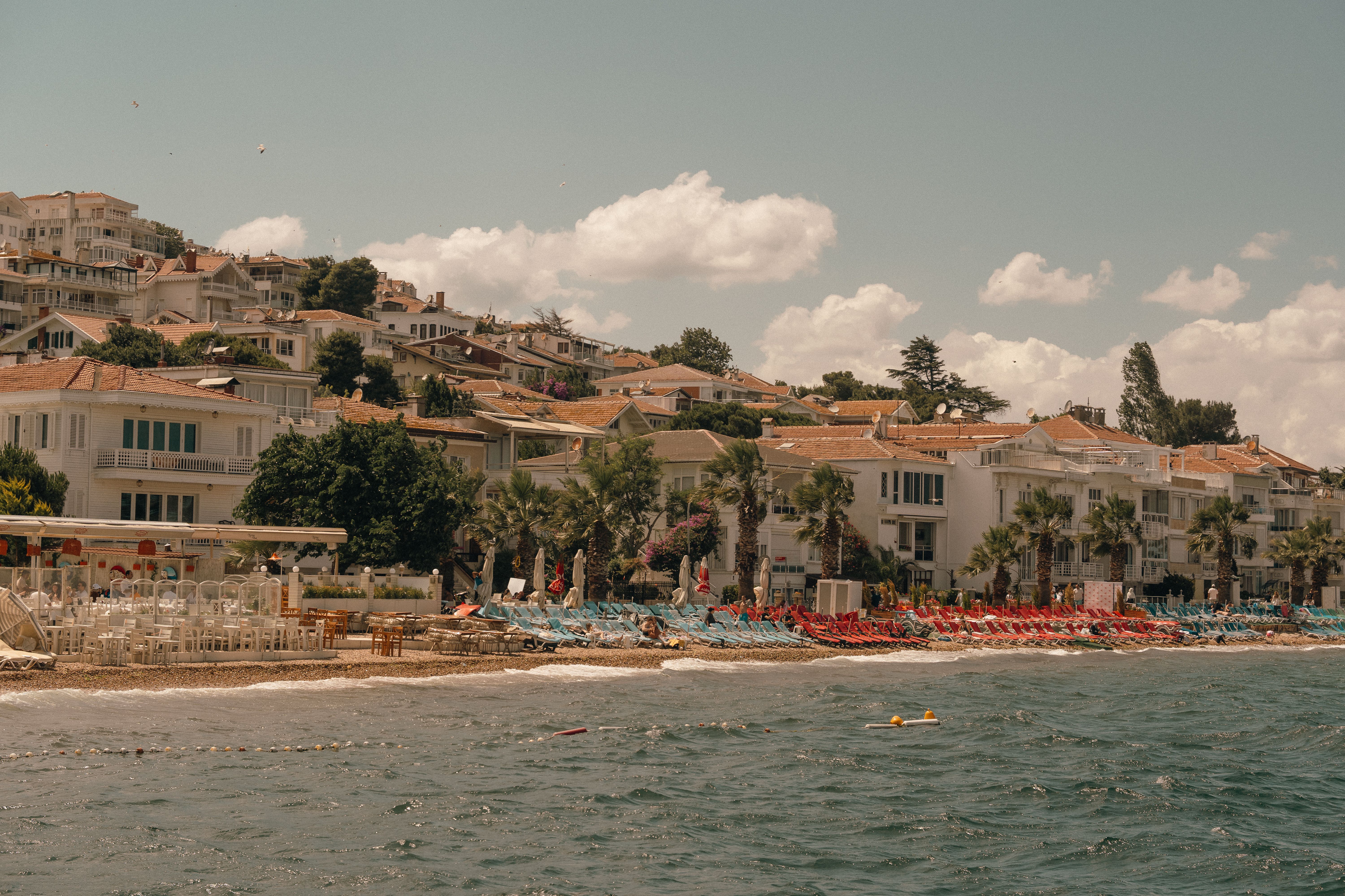 Scenic Coastal View of Mediterranean Beachfront Villas · Free Stock Photo