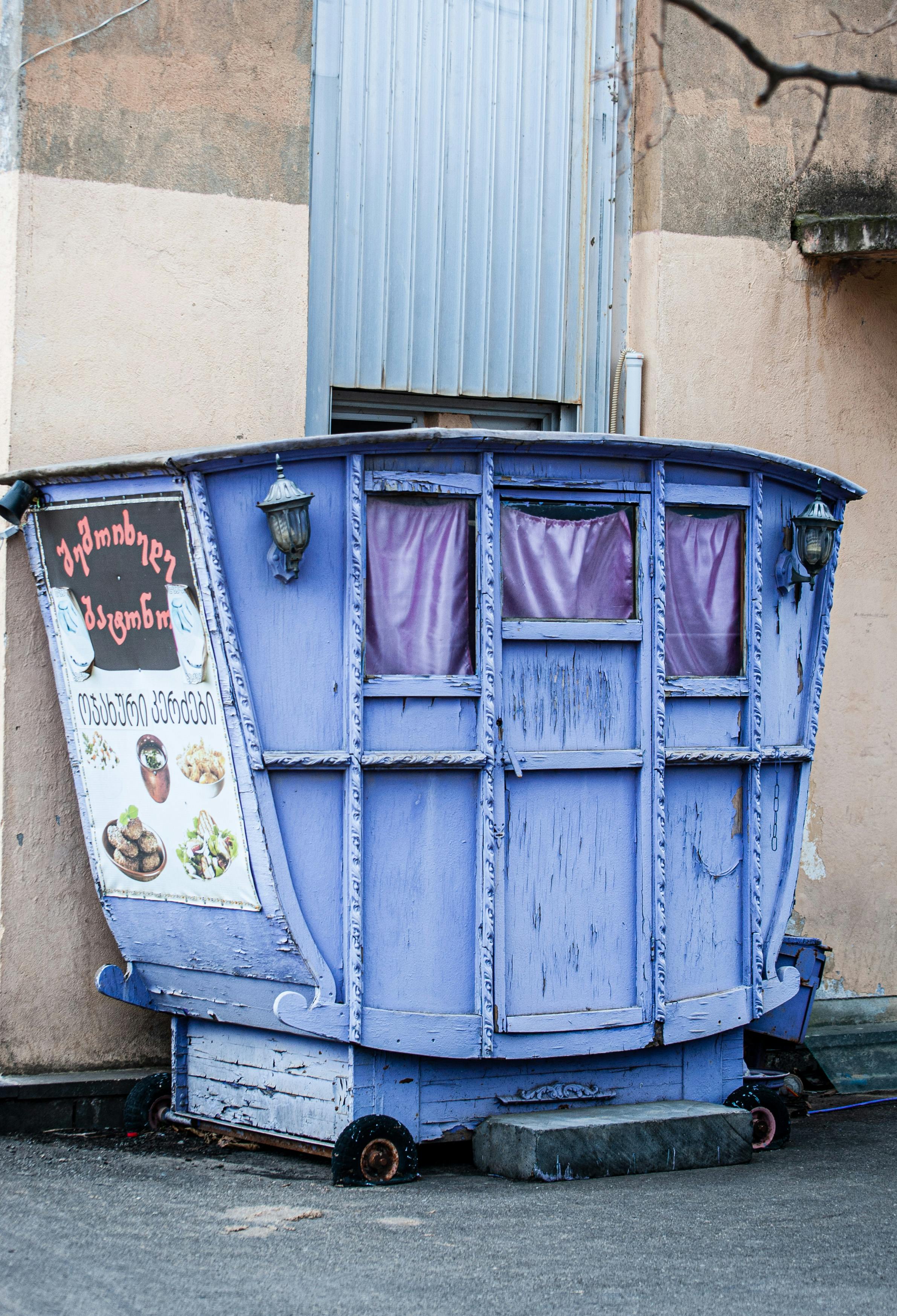 Rustic Blue Kiosk in Urban Setting · Free Stock Photo