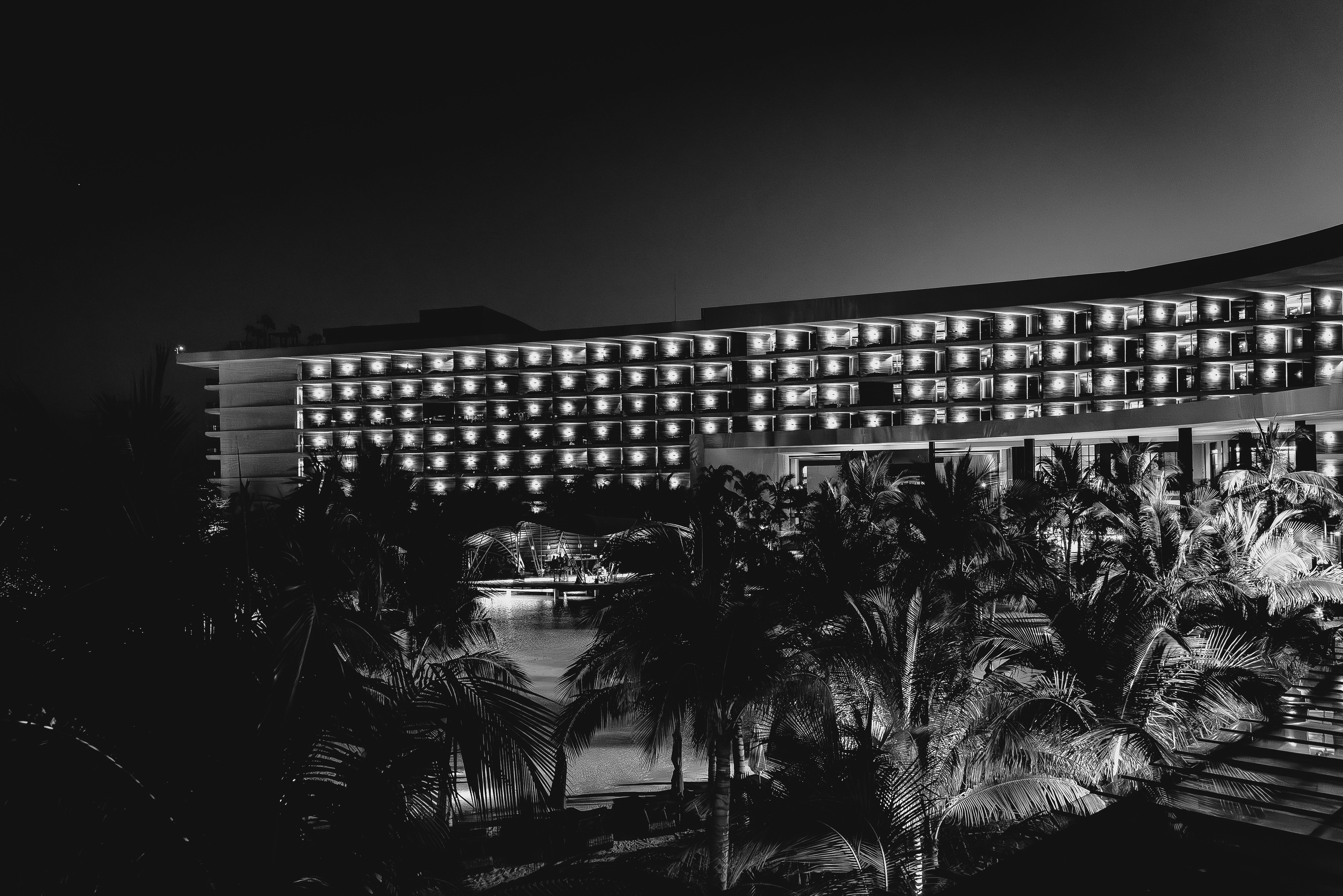 Scenic Night View of a Modern Hotel with Illuminated Balconies · Free Stock Photo