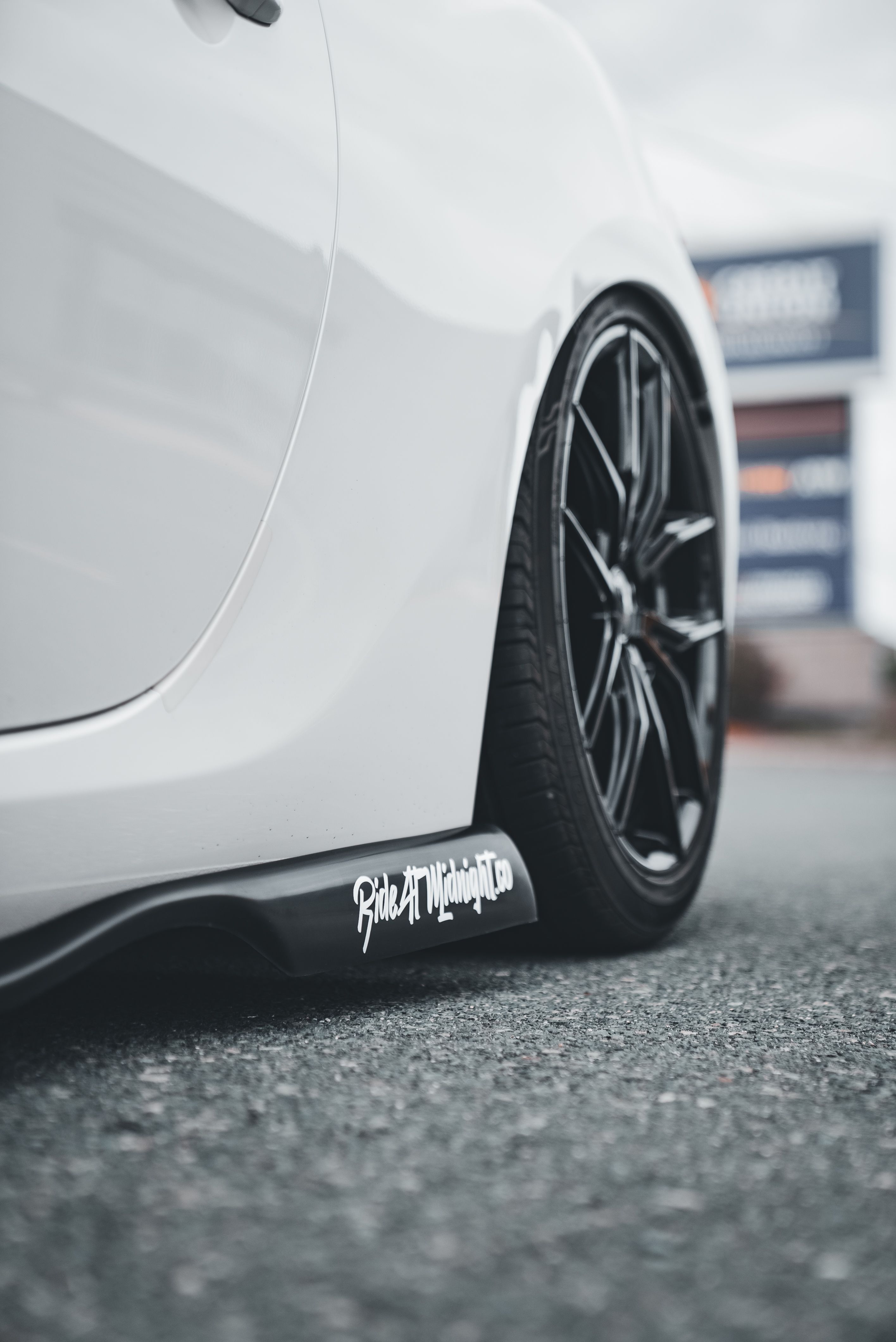 Close-Up of a Car's Wheel with Custom Rims · Free Stock Photo